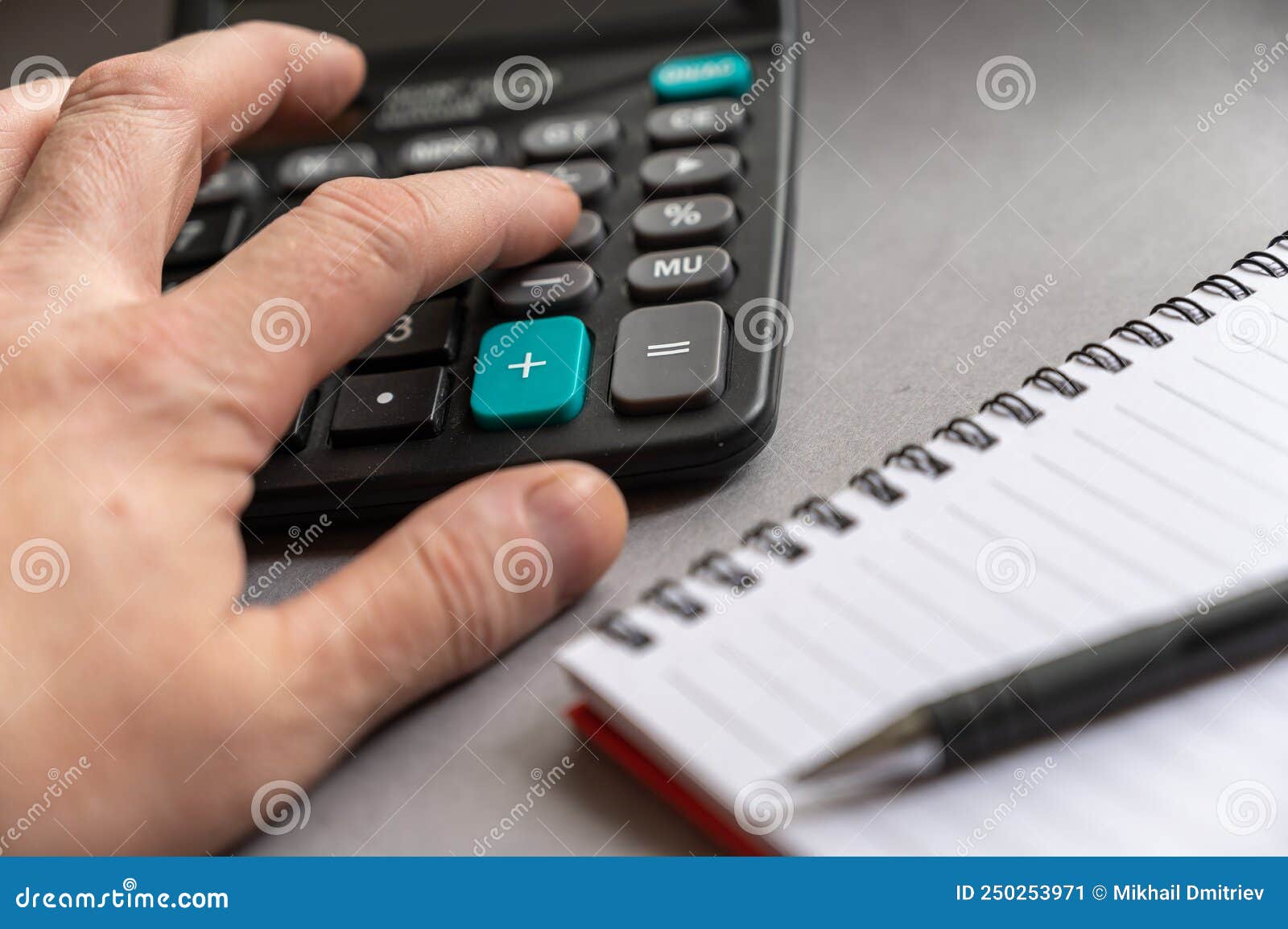 Close-up of a Man`s Hand Doing Calculations on a Calculator. the Index ...