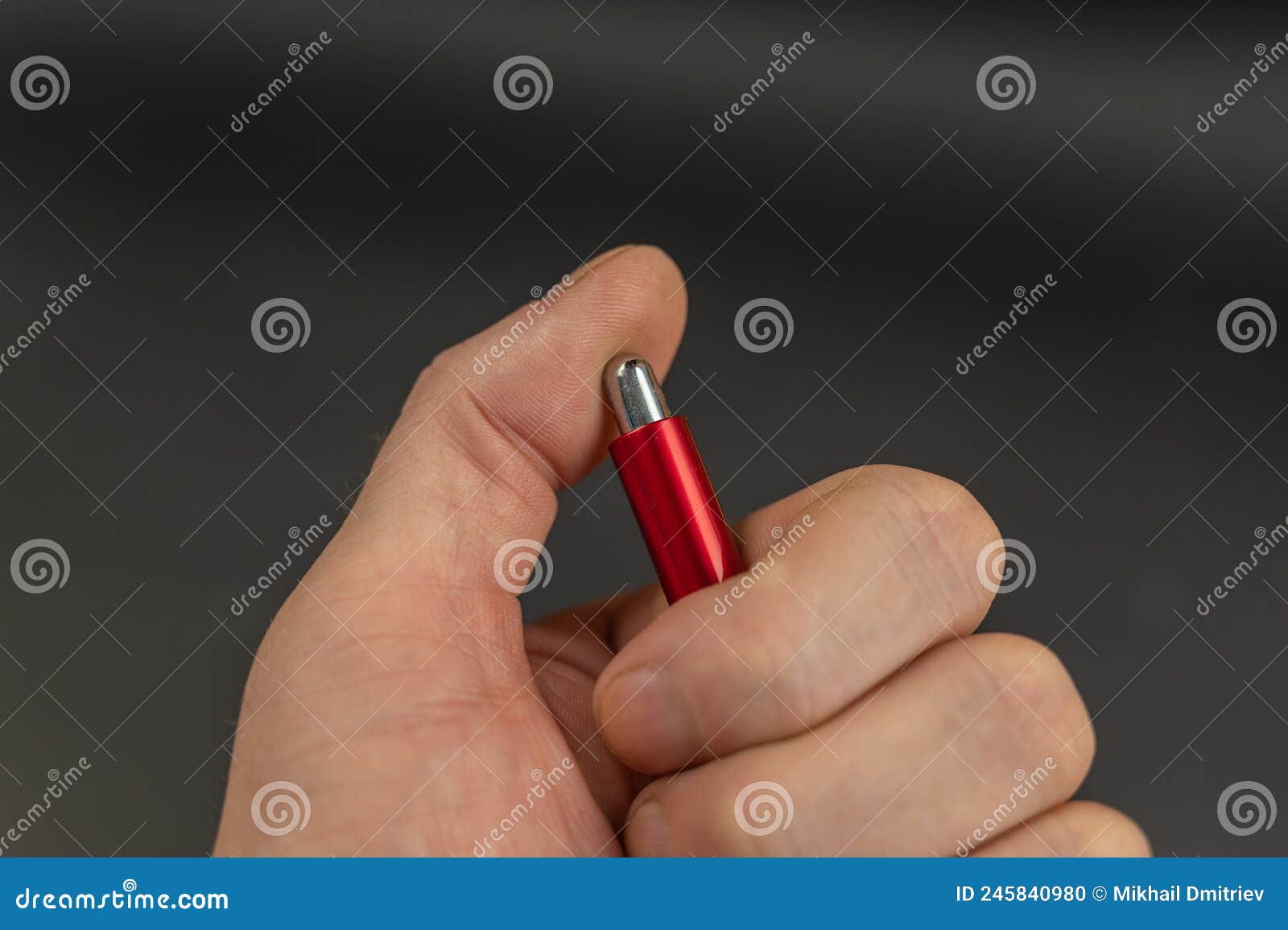 Close-up of a Man`s Hand Pressing a Ballpoint Pen Button. the Thumb of ...