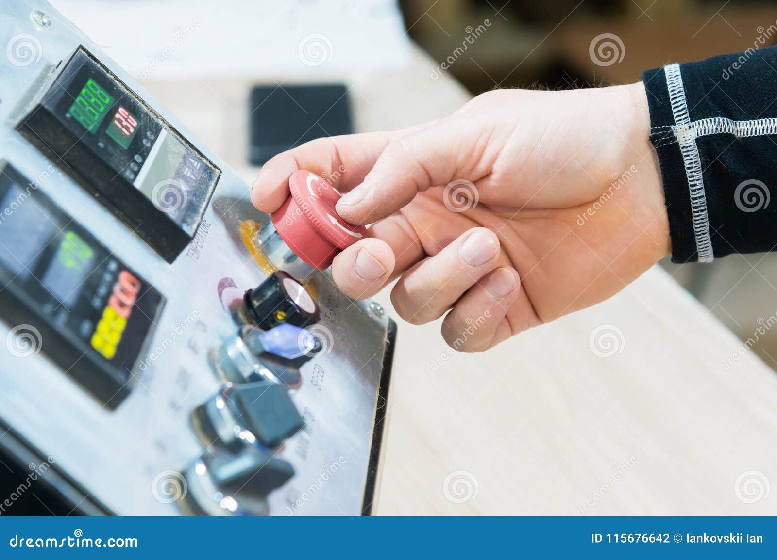 Close-up of a Man`s Hand on a Red Button on the Control Panel ...