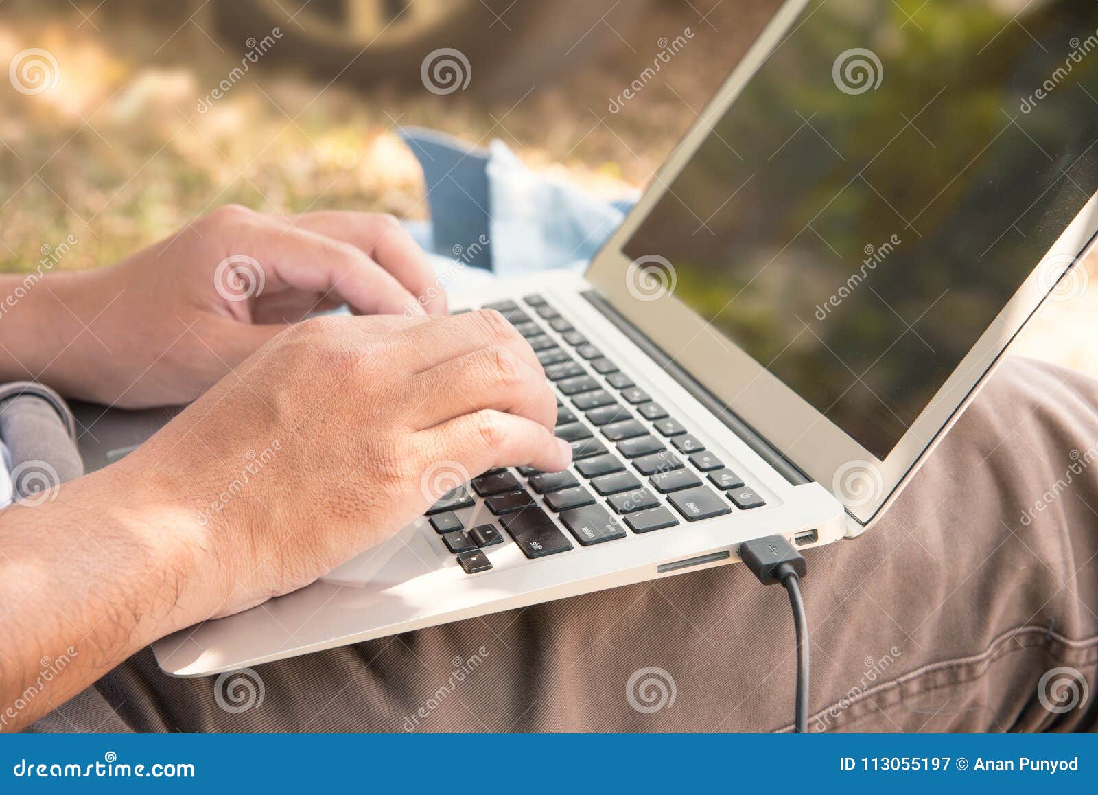 Close Up Man`s Hand are Using Their Laptops on the Legs Stock Image ... Close Up Man`s Hand are Using Their Laptops on the Legs Stock Image ...