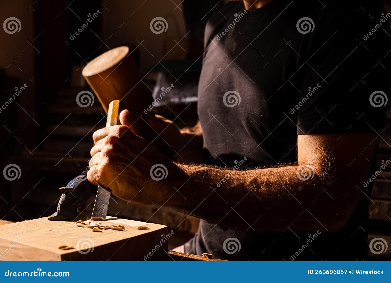 Close Up of Man& X27;s Hands Using a Chisel and a Mallet on a Piece of ...