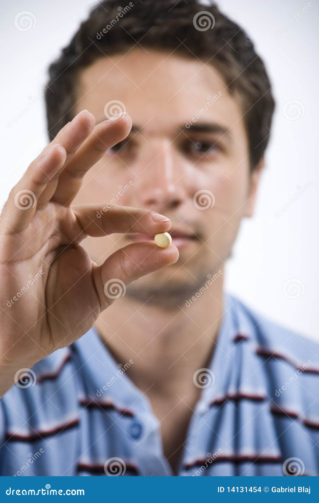 Close up man showing pill stock photo. Image of interior - 14131454