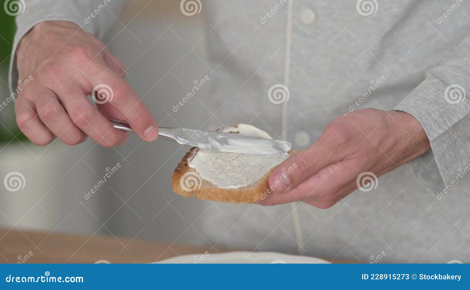 Close Up of Man Spreading Butter on Bread Stock Image - Image of ...