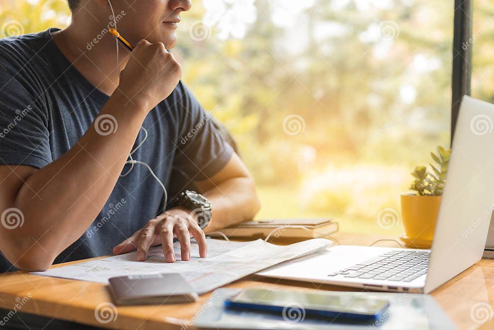 Close Up Man is Thinking while Writing Note with Laptop Stock Photo ...