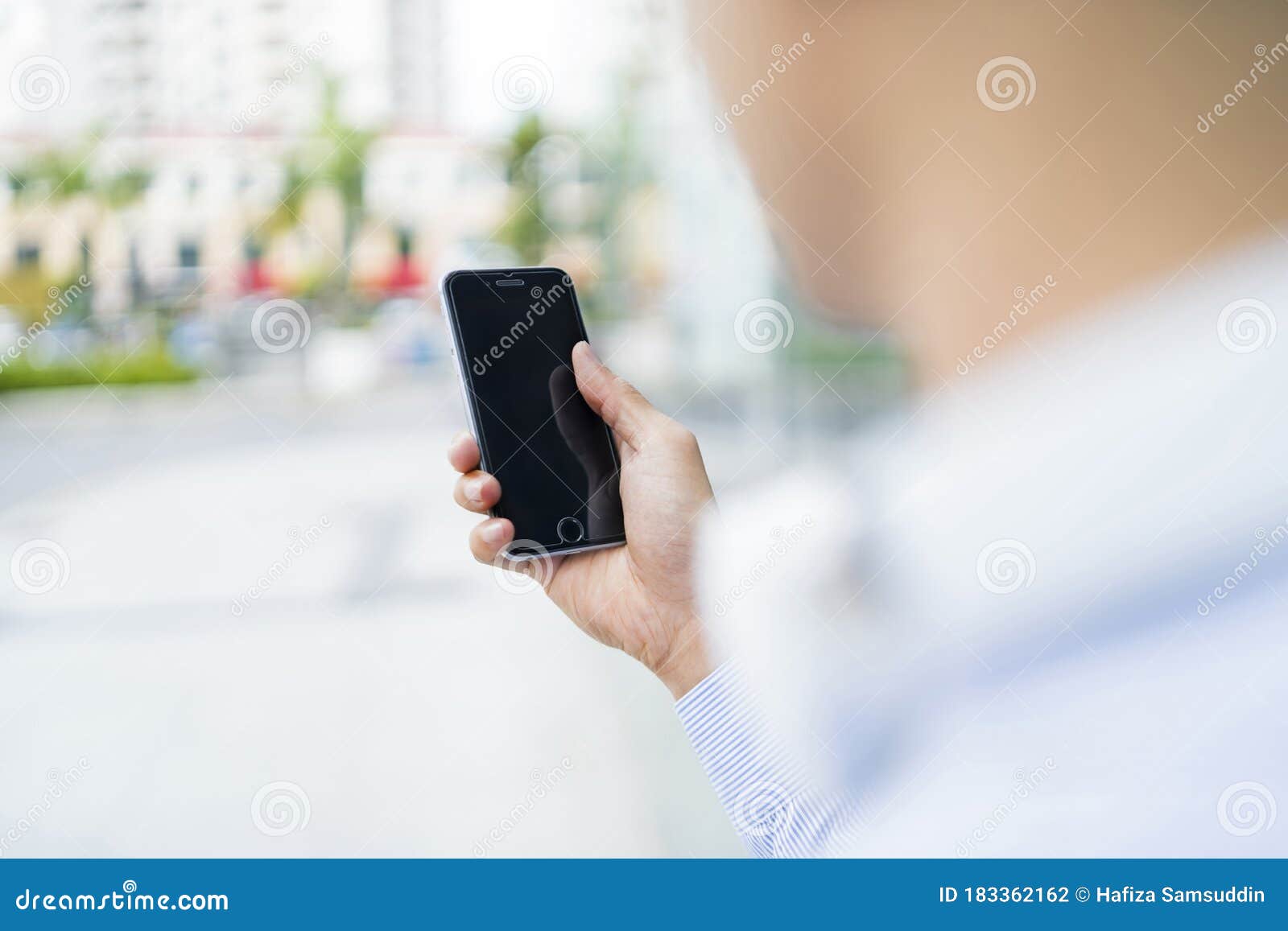 Man using his phone stock photo. Image of holding, connection - 183362162