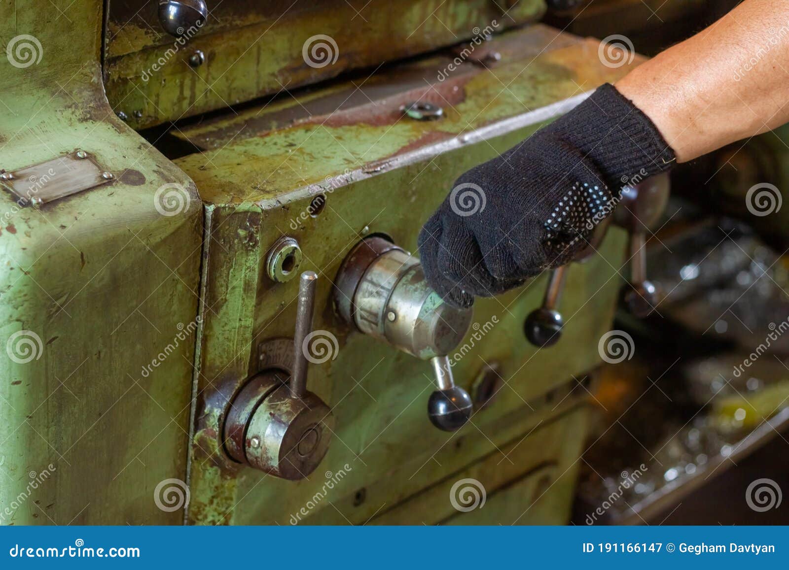 Close Up of a Man Using a Machine, Close Up of a Man Working on a ...
