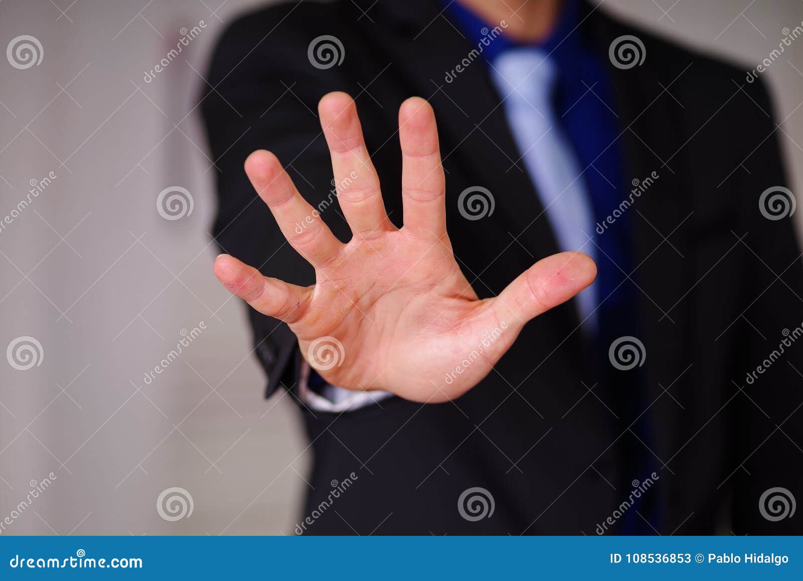 Close Up of Man Wearing a Suit with His Open Hand Pointing in Front of ...