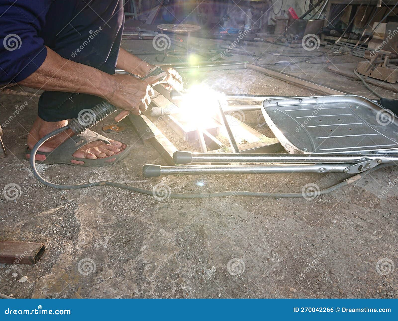 Close Up, Man Welding Broken Chair at His Workshop Stock Photo - Image ...