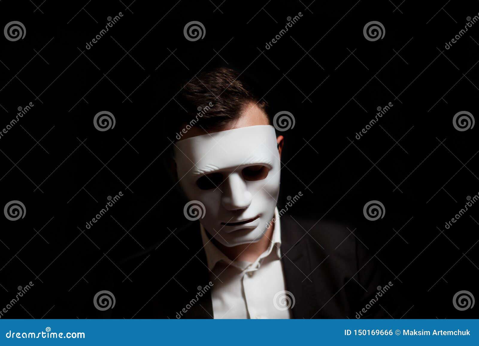 Close-up of a Man in a White Mask on a Black Background Stock Photo ...