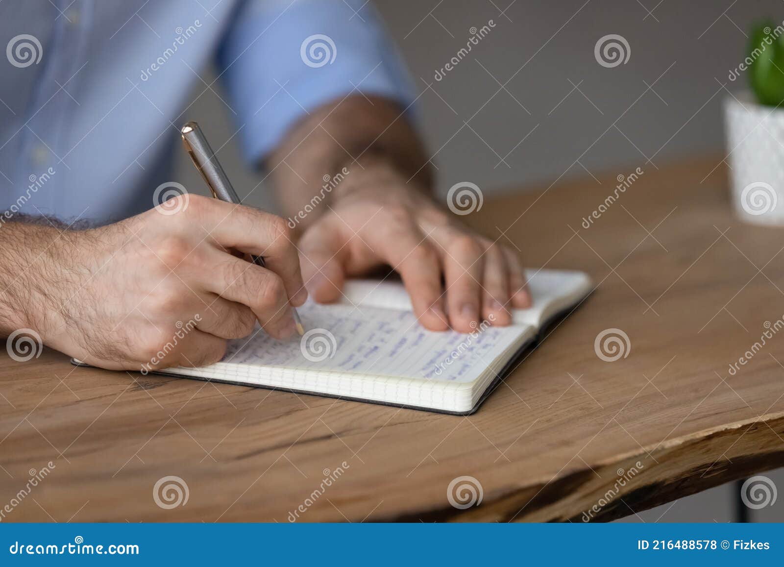 Close Up of Man Write in Notepad at Desk Stock Photo - Image of ...