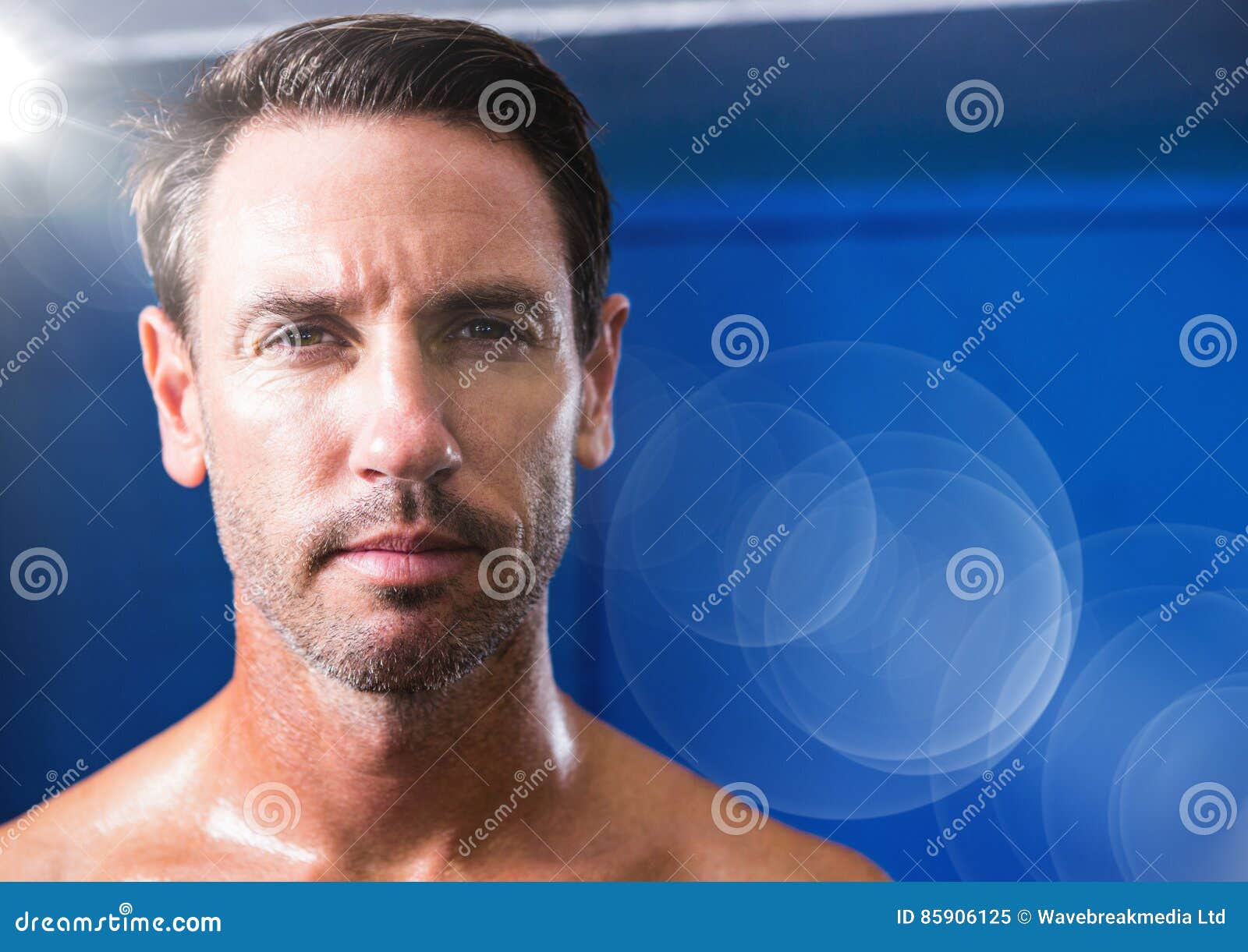 Close Up of Mans Face with Flare Against Blue Background Stock ...