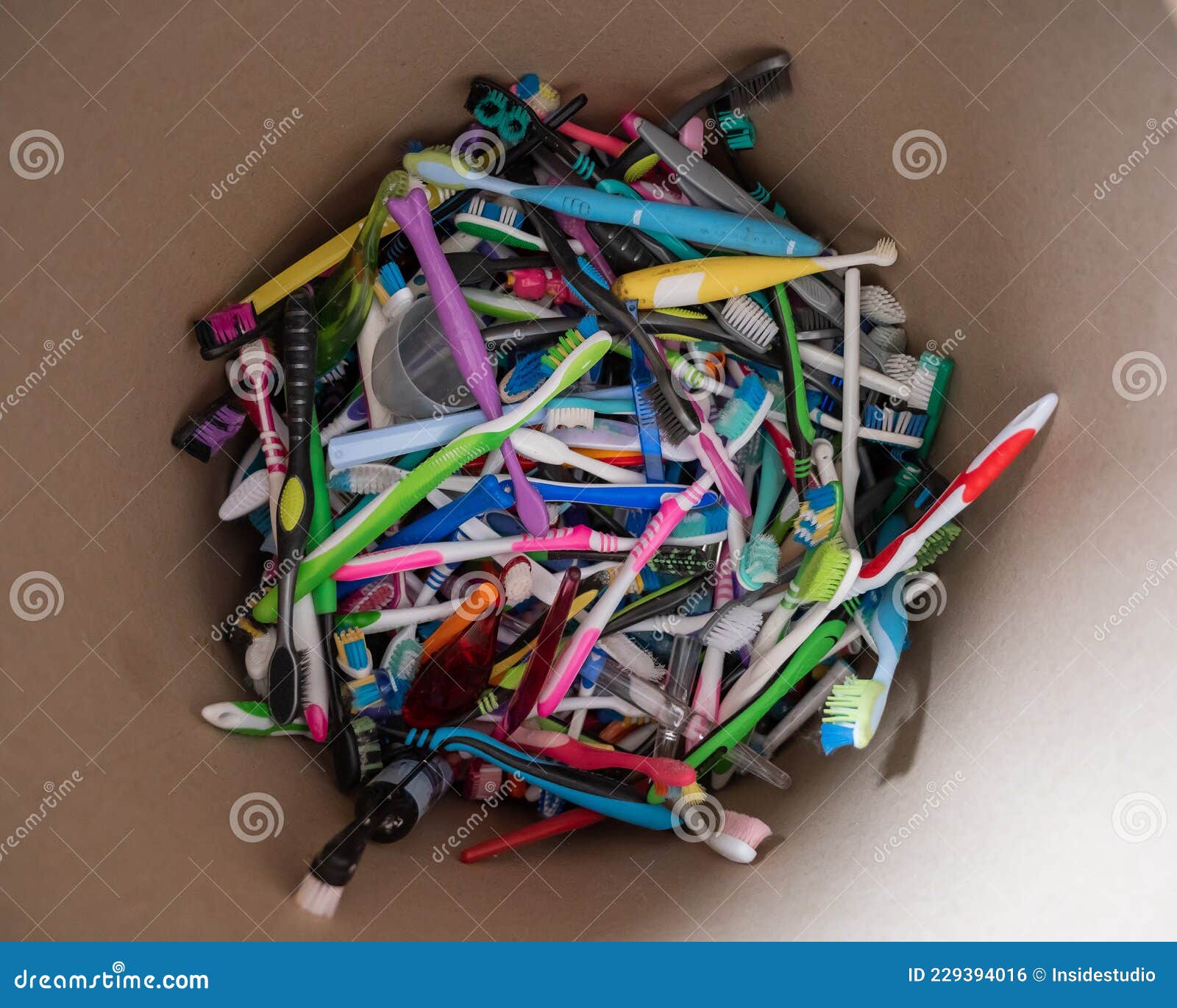 A Close-up of Many Used Plastic Toothbrushes Collected for Recycling ...