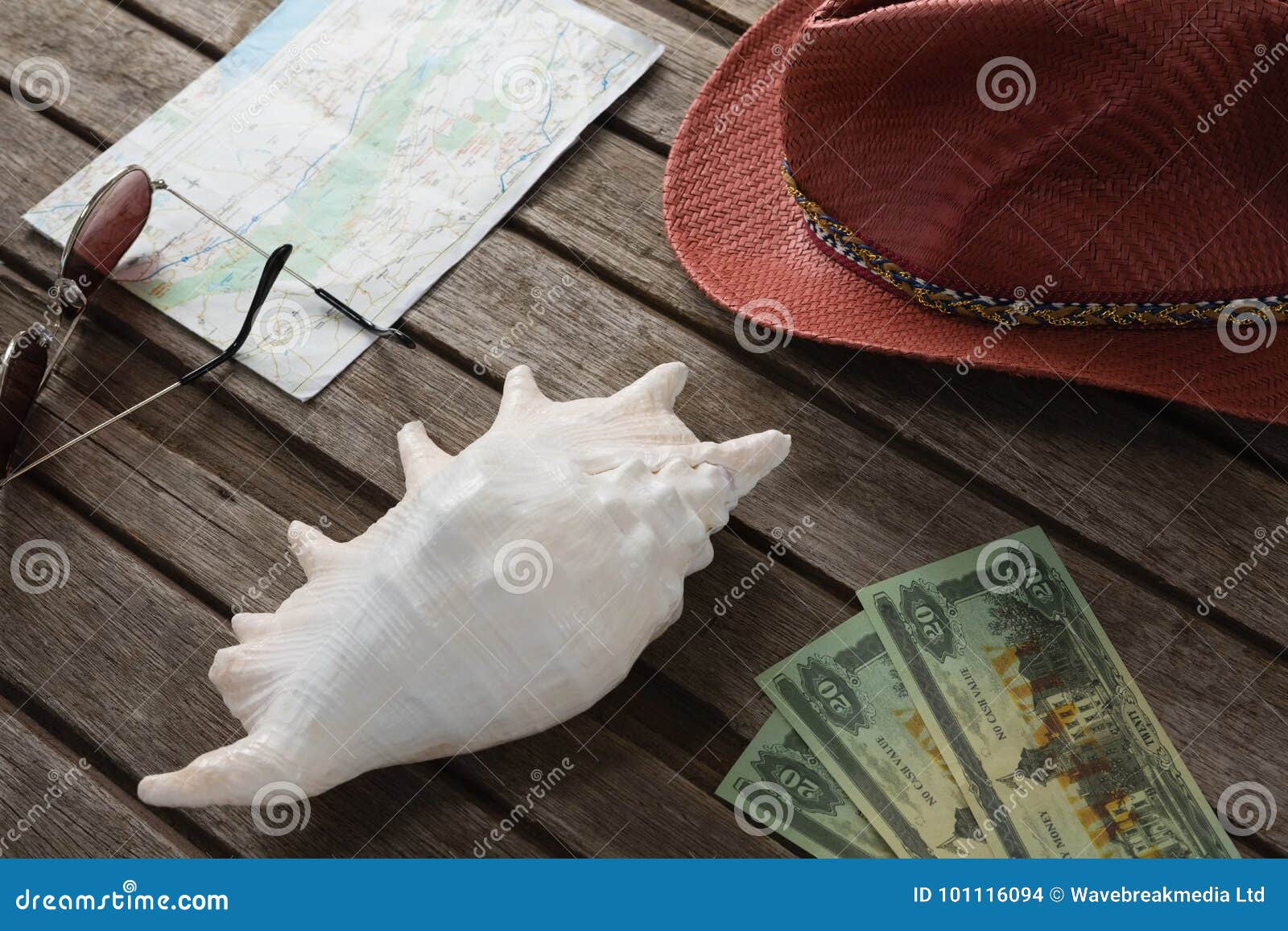 Map, Hat, Seashell, Currency Notes and Sunglasses on Wooden Plank Stock ...