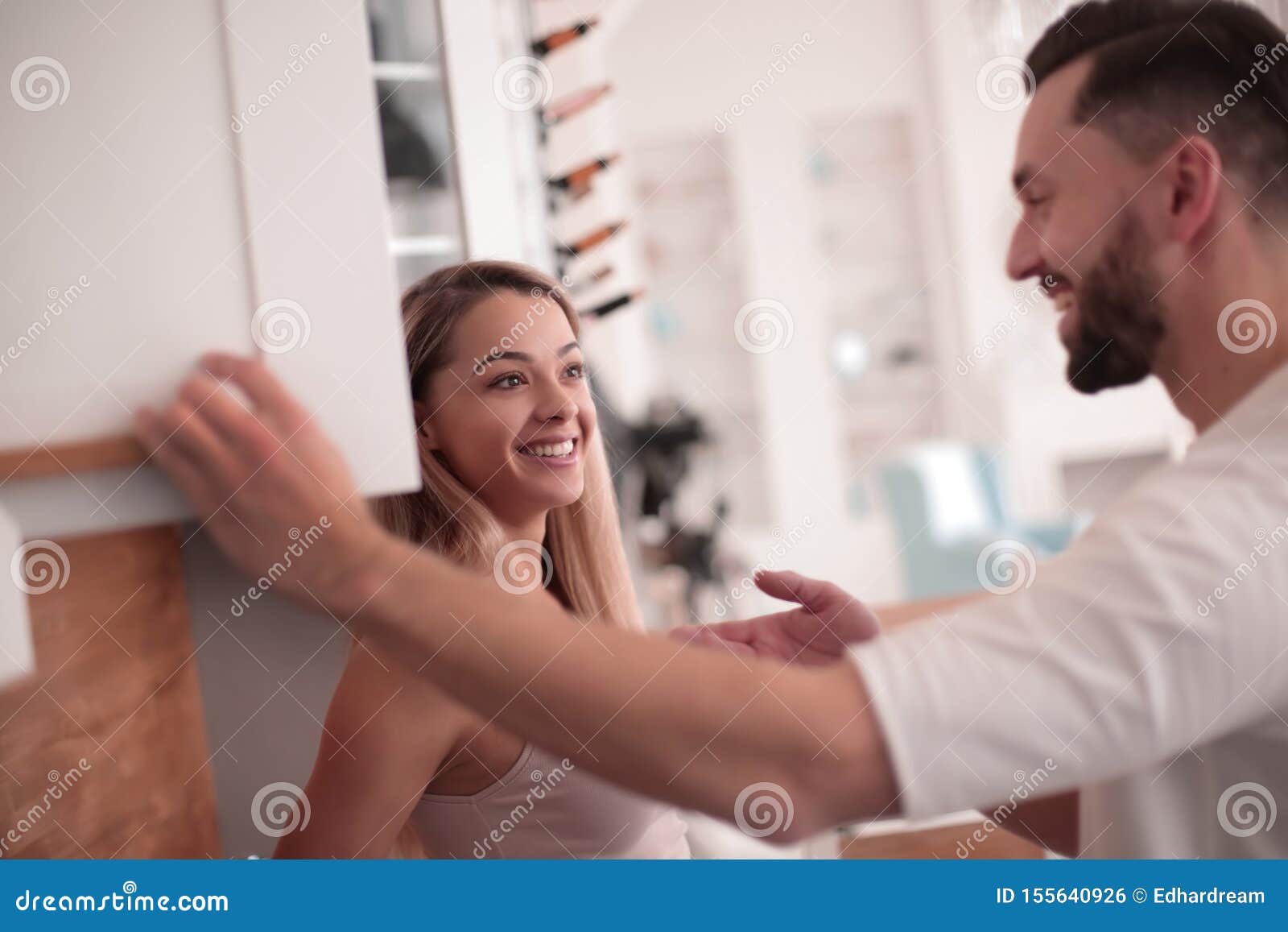 Close Up. a Married Couple Talking Standing in Their Kitchen. Stock ...