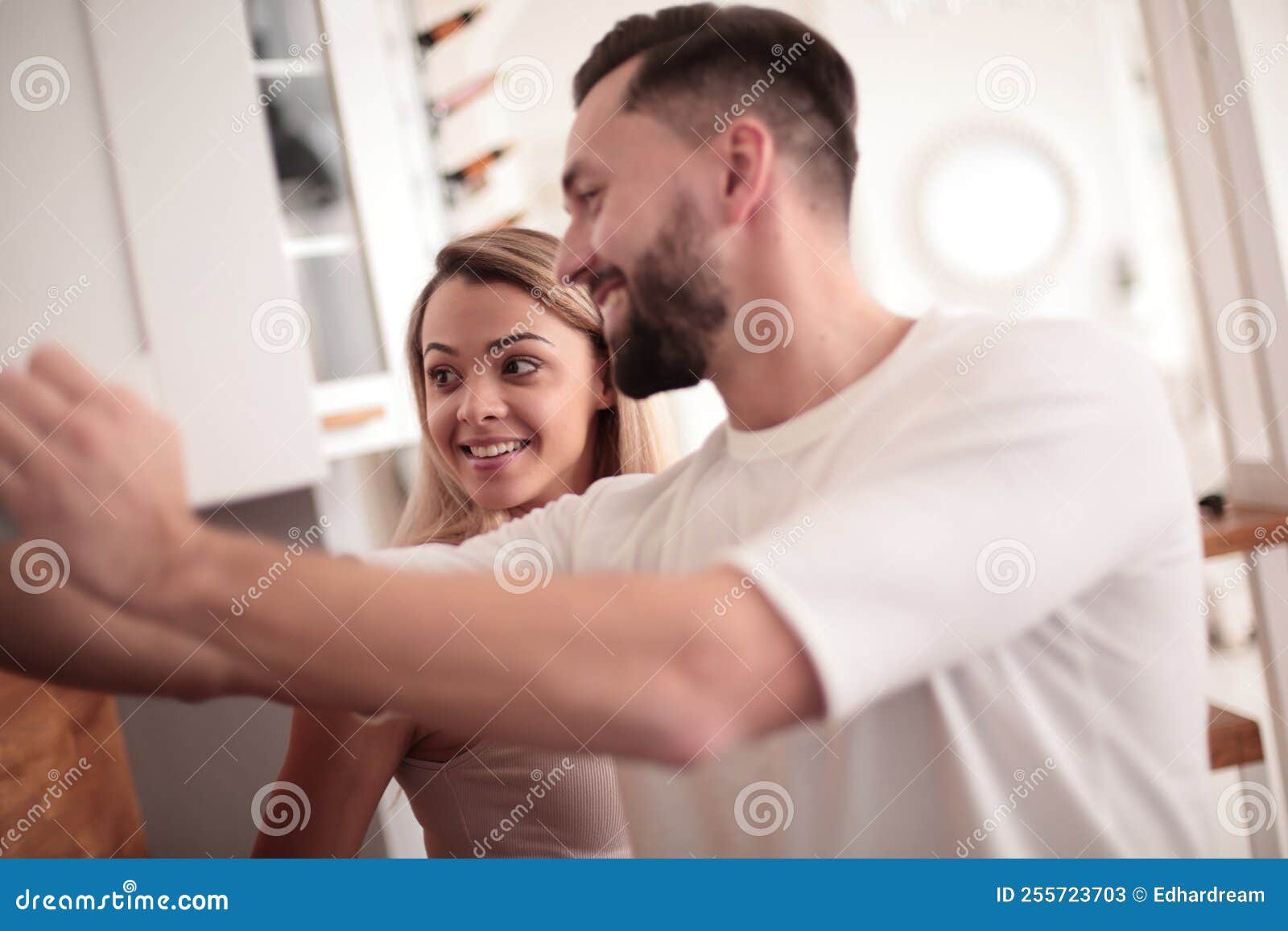 Close Up. a Married Couple Talking Standing in Their Kitchen. Stock ...