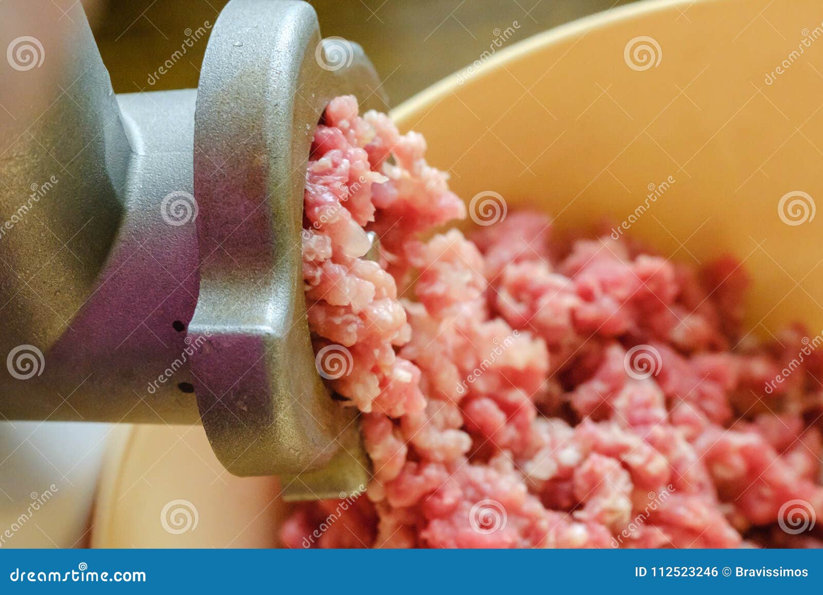 Close Up Meat Grinder or Mincing-machine with Mincemeat in. Showing the ...