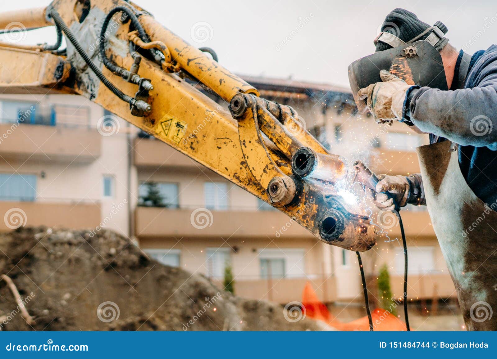 Mechanic Fixing Excavator on Construction Site Stock Photo - Image of ...