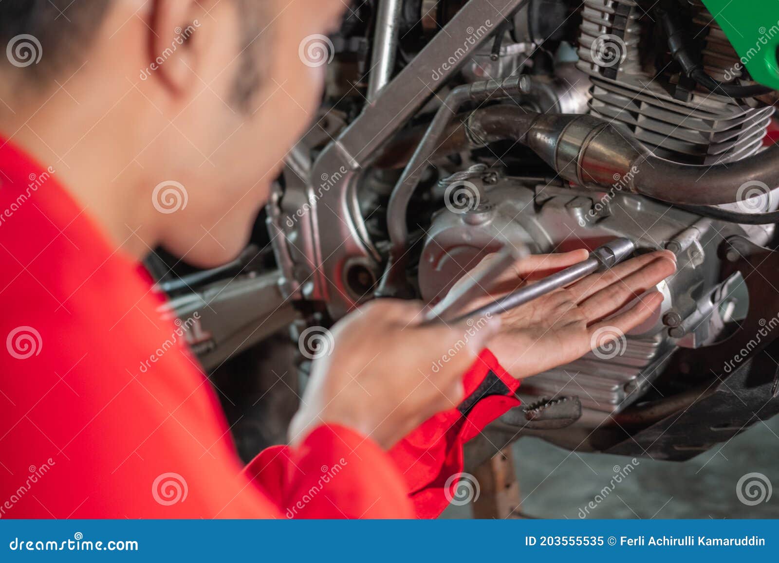 Close Up of Mechanic Opening the Motor Engine Bolt Using a T Socket ...