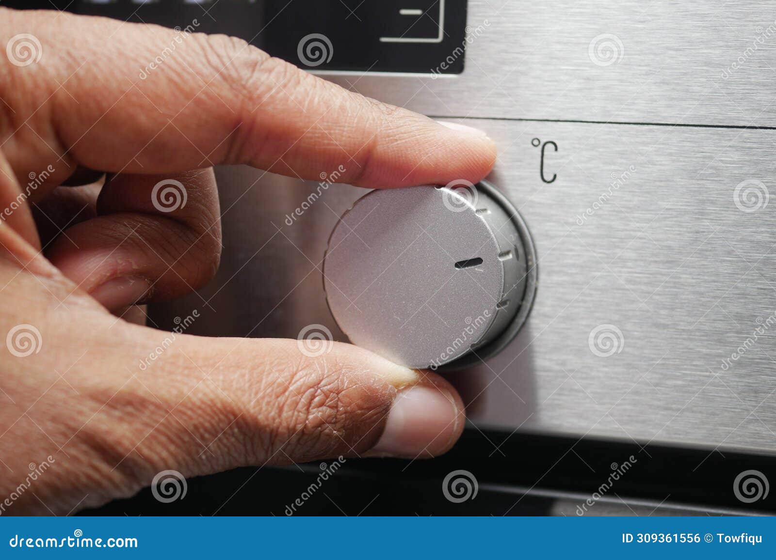 Close Up of Men Hand Setting Temperature Control on Oven. Stock Photo ...