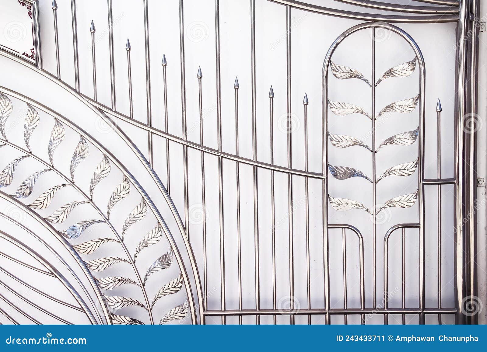 Metal Fence Temple with Leaf Patterns on White Concrete Wall Background ...