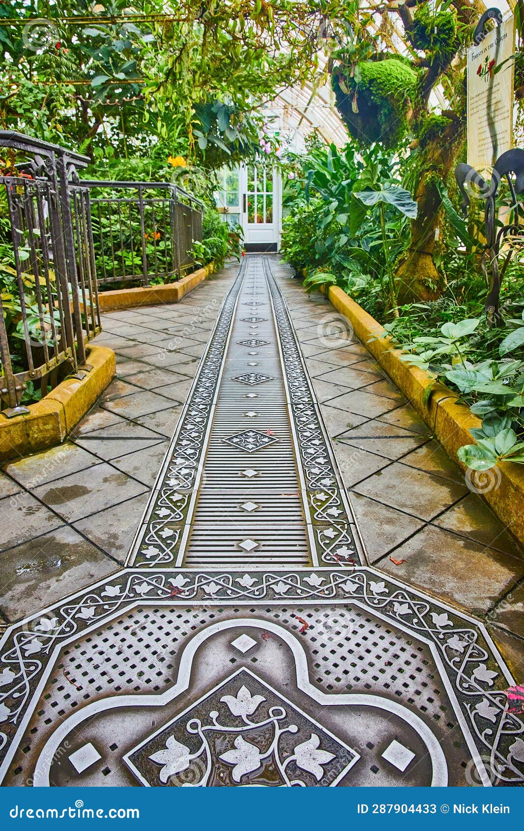 Close Up of Metal Grating on Tile Walkway Inside Conservatory with ...