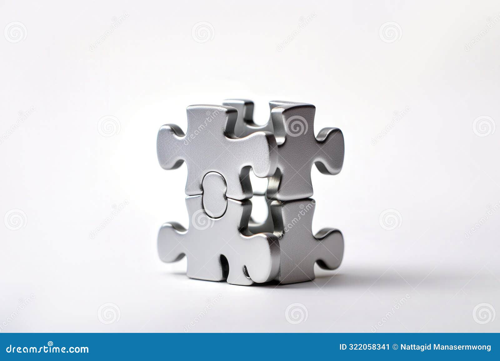 Close-up of a Metallic Puzzle Piece Assembly on a White Background ...