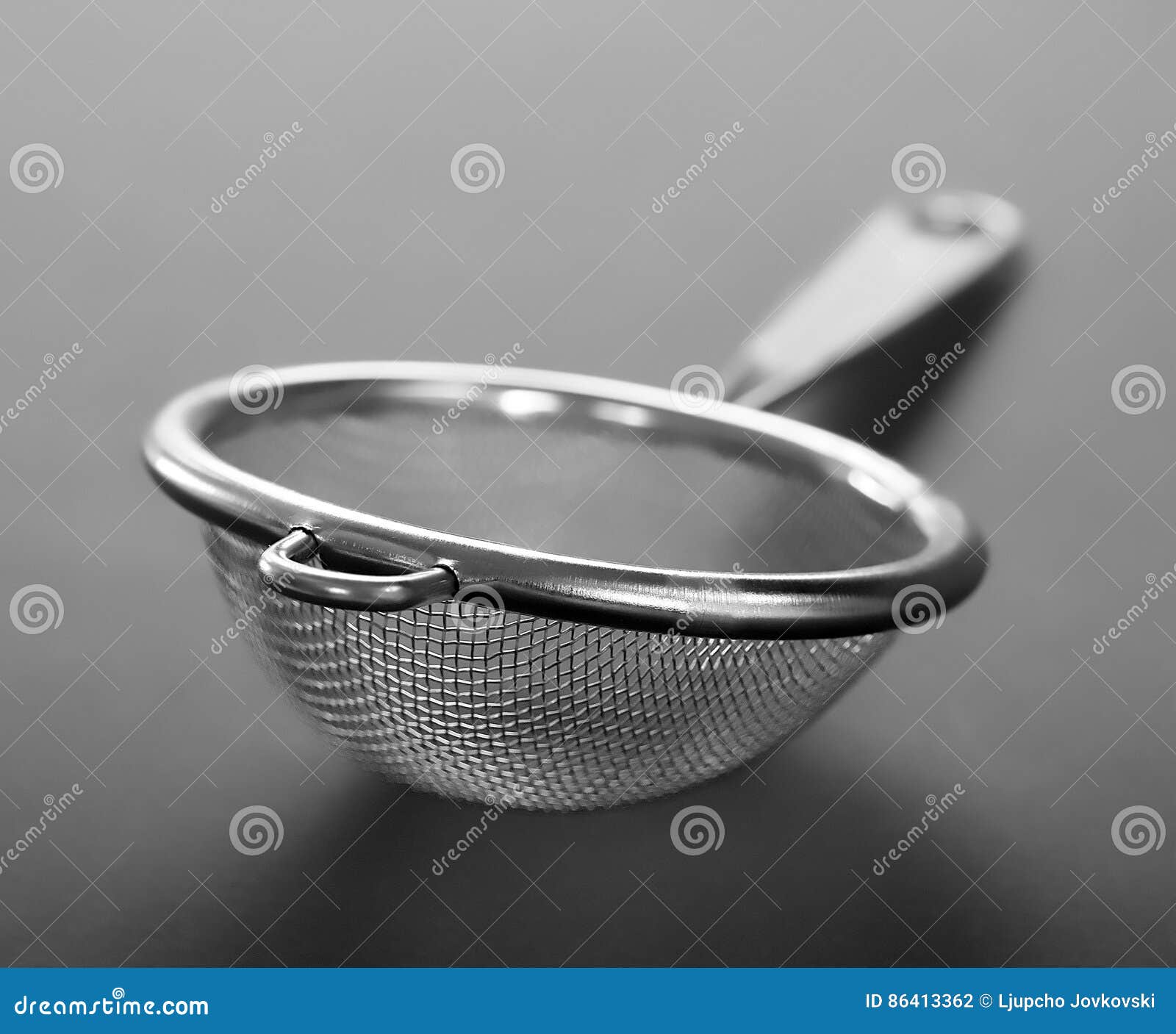 Close Up of Metallic Strainer with Plastic Handle Stock Photo - Image ...