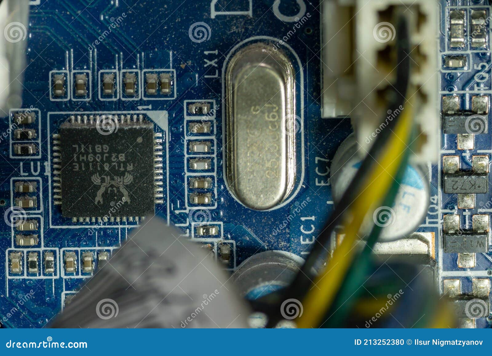 Close-up of Microcircuits and Transistors on Blue Motherboard in ...