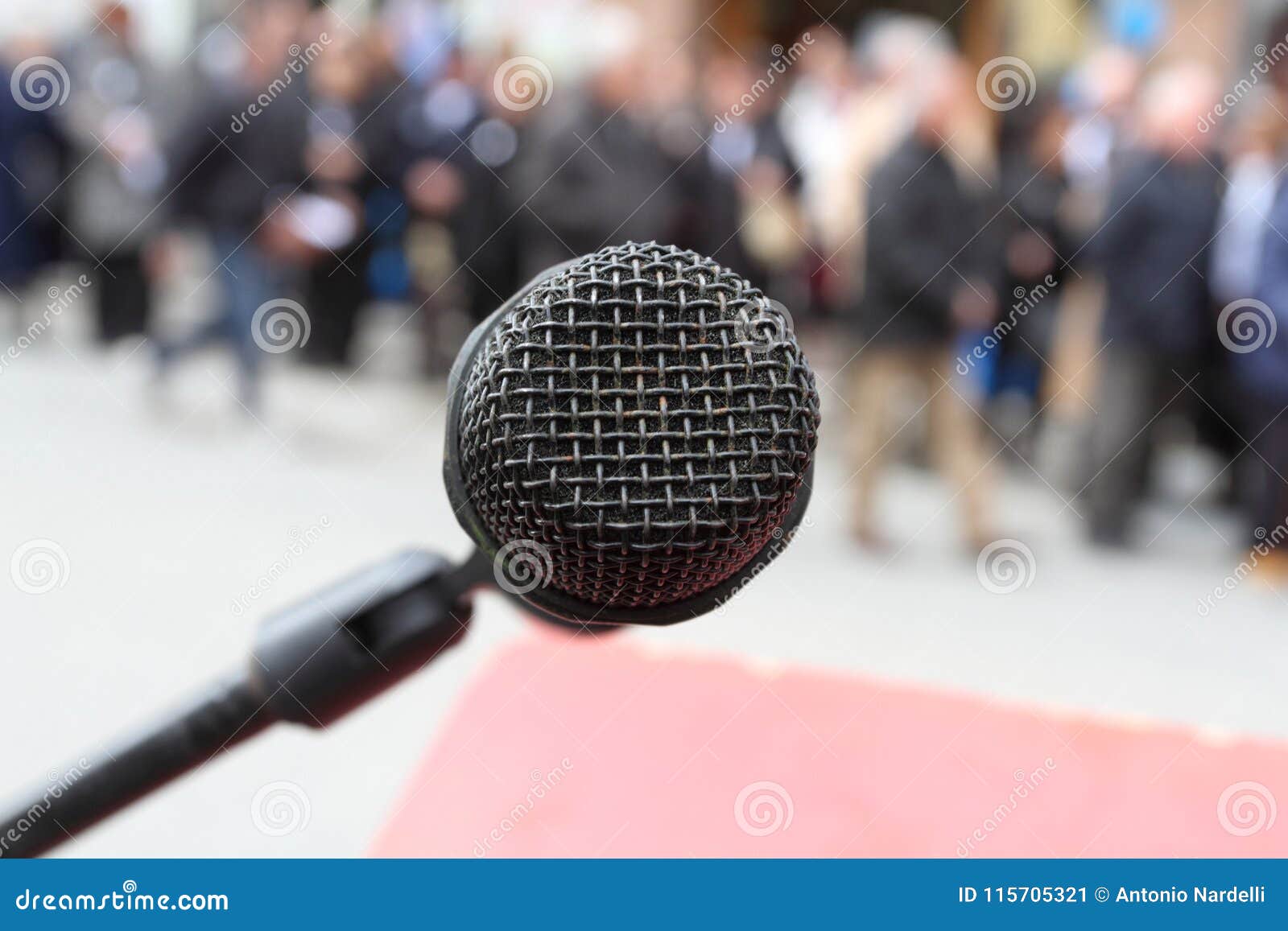 Close-up on the Microphone and the Crowd Blurred Behind Stock Image ...