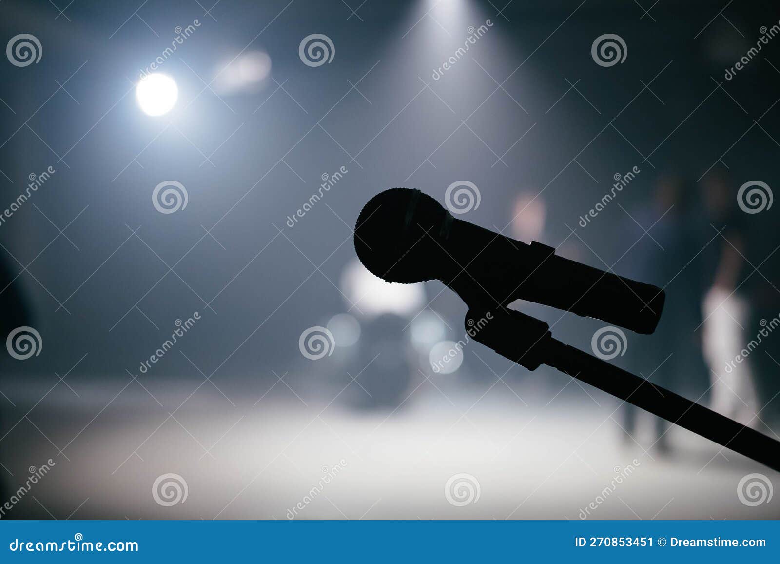 A Close Up of a Microphone. the Silhouette Shows the Mic on the Stand ...