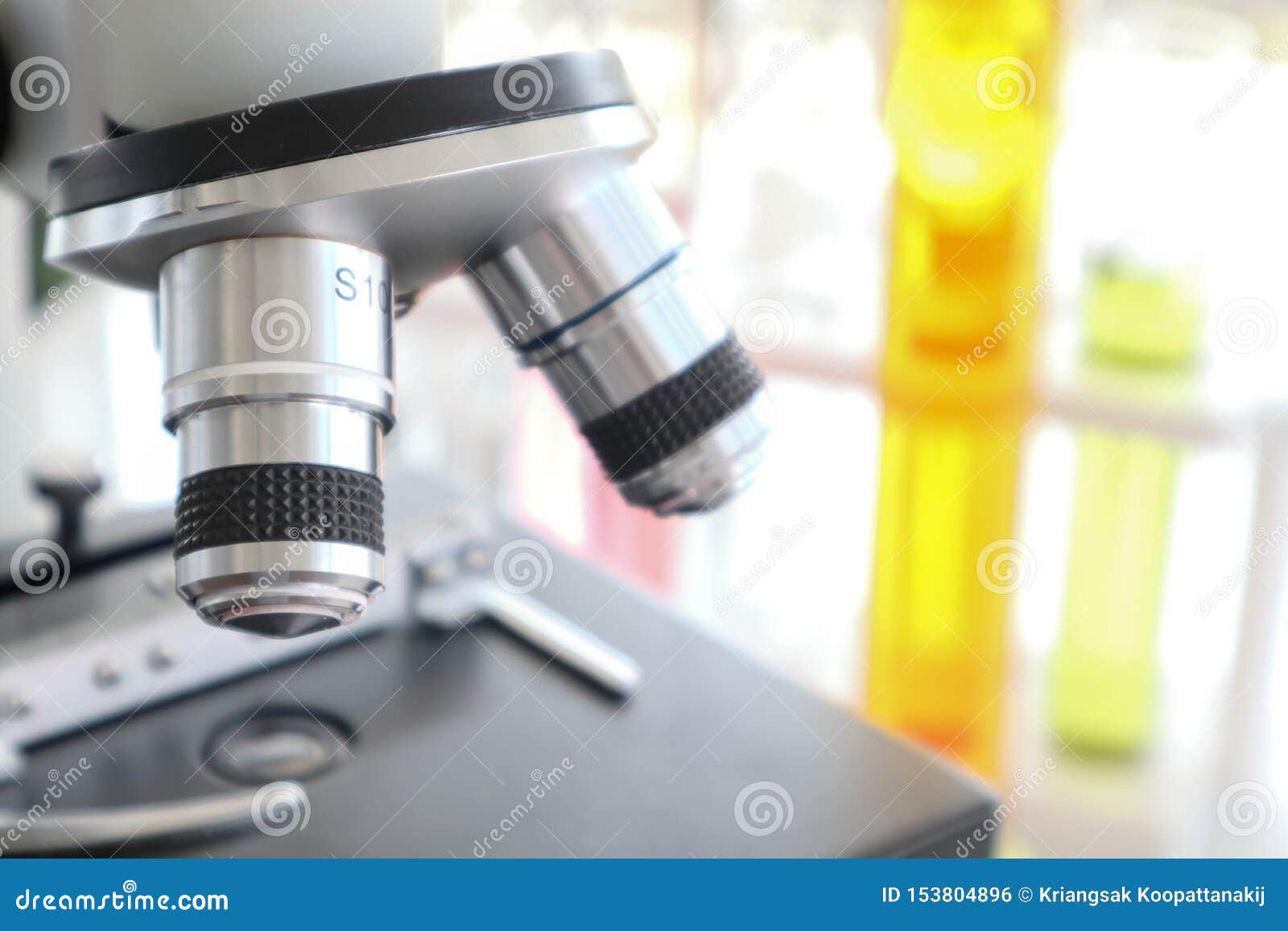 Close Up of Microscope in Laboratory with Blurred Background of Glass ...