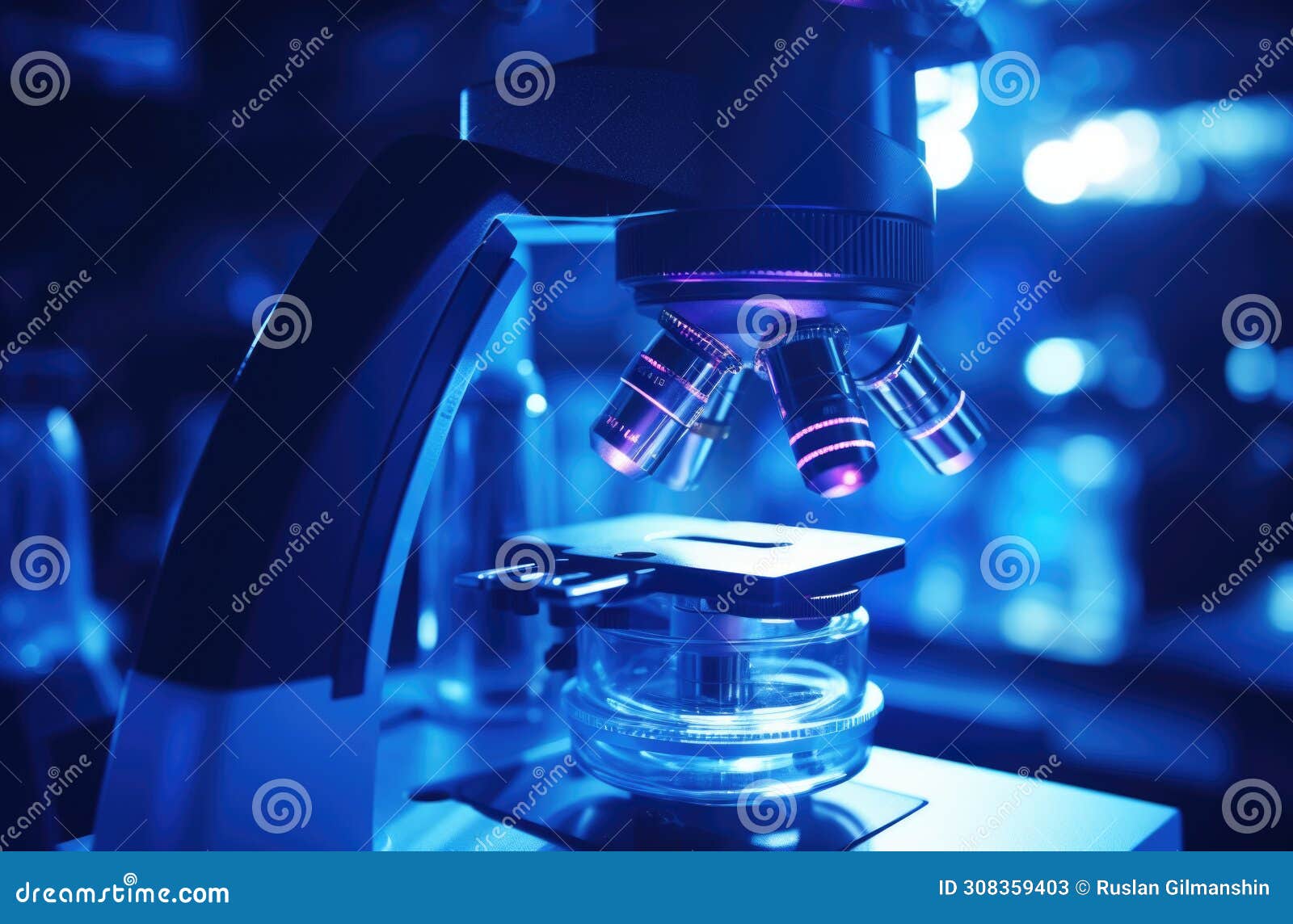 Close Up of Microscope Lenses Focused on a Specimen in Blue Light Stock ...