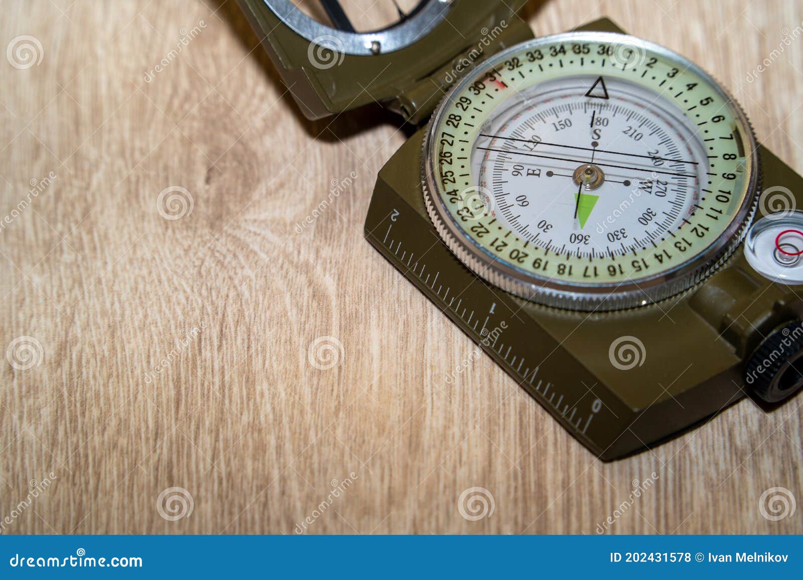 Close-up of a Military Compass on a Wooden Surface. Determining the ...