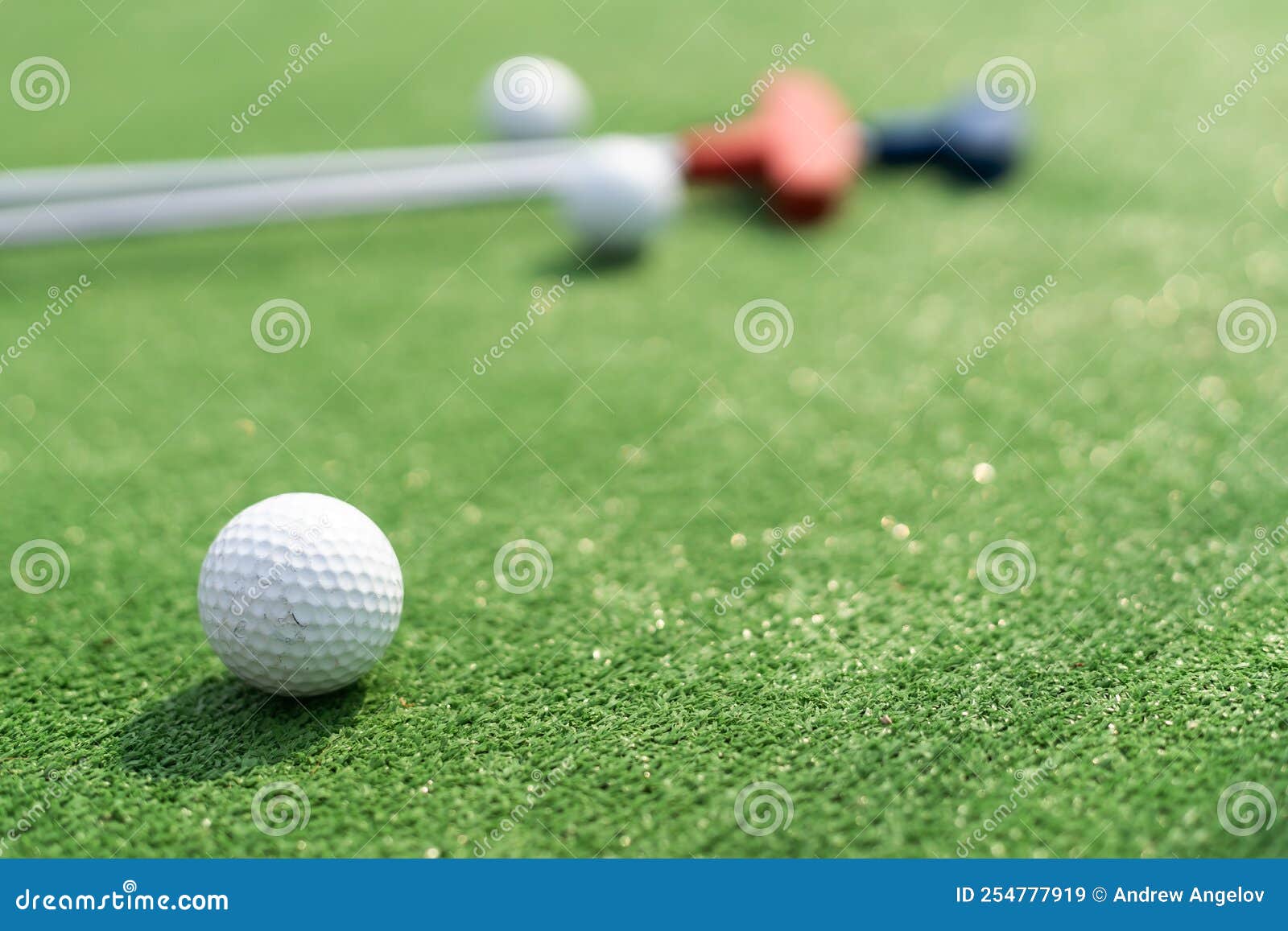 Close-up of Miniature Golf Hole with Bat and Ball Stock Image - Image ...