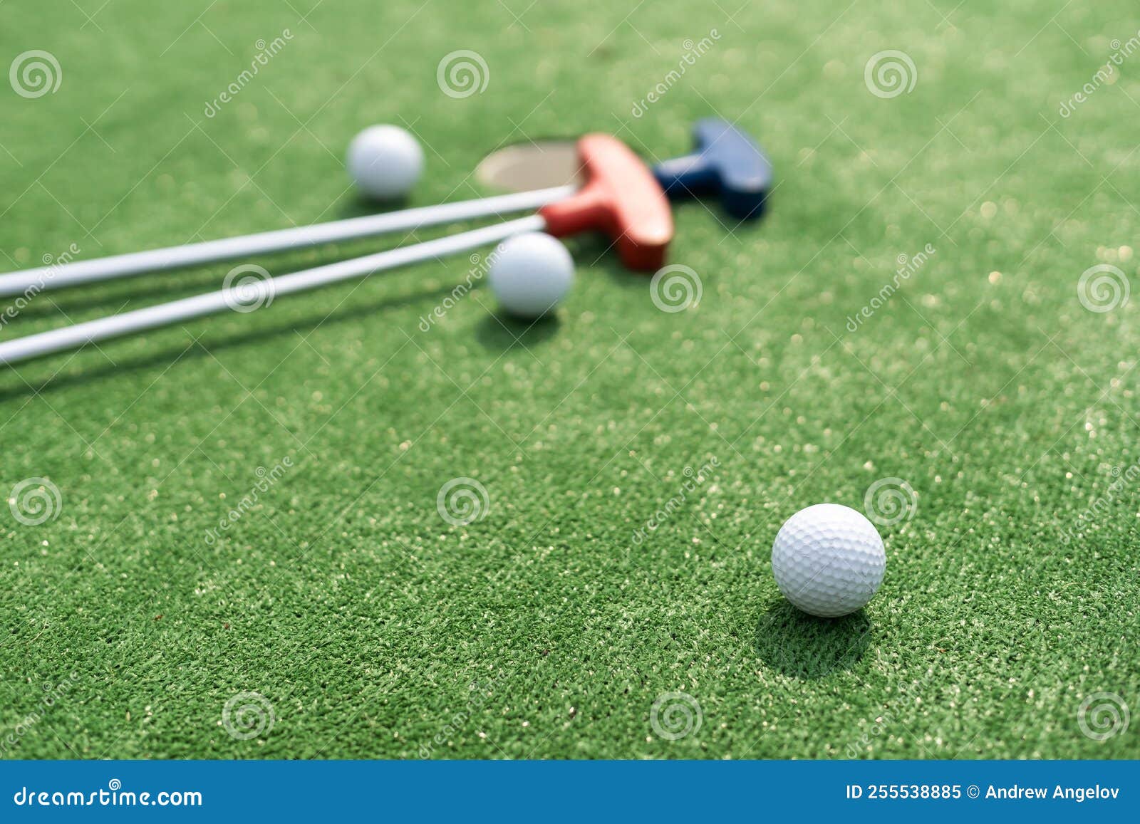 Close-up of Miniature Golf Hole with Bat and Ball Stock Image - Image ...