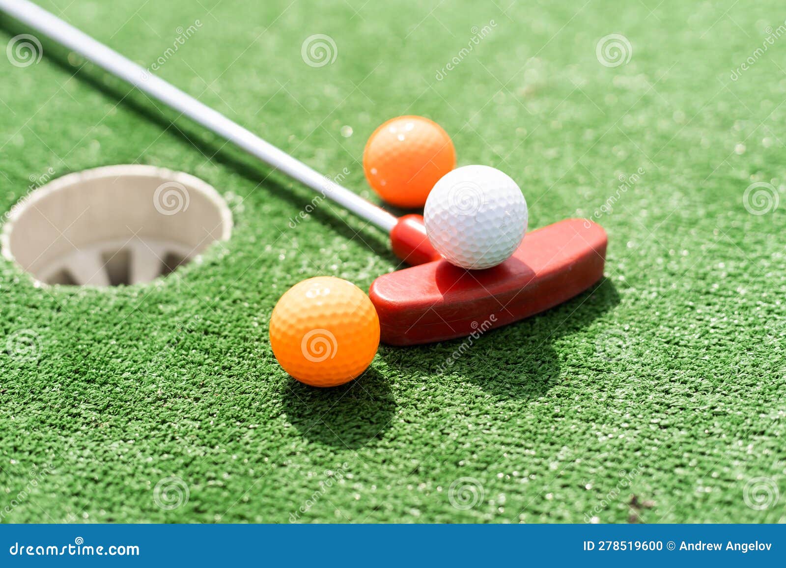 Close-up of Miniature Golf Hole with Bat and Ball Stock Photo - Image ...