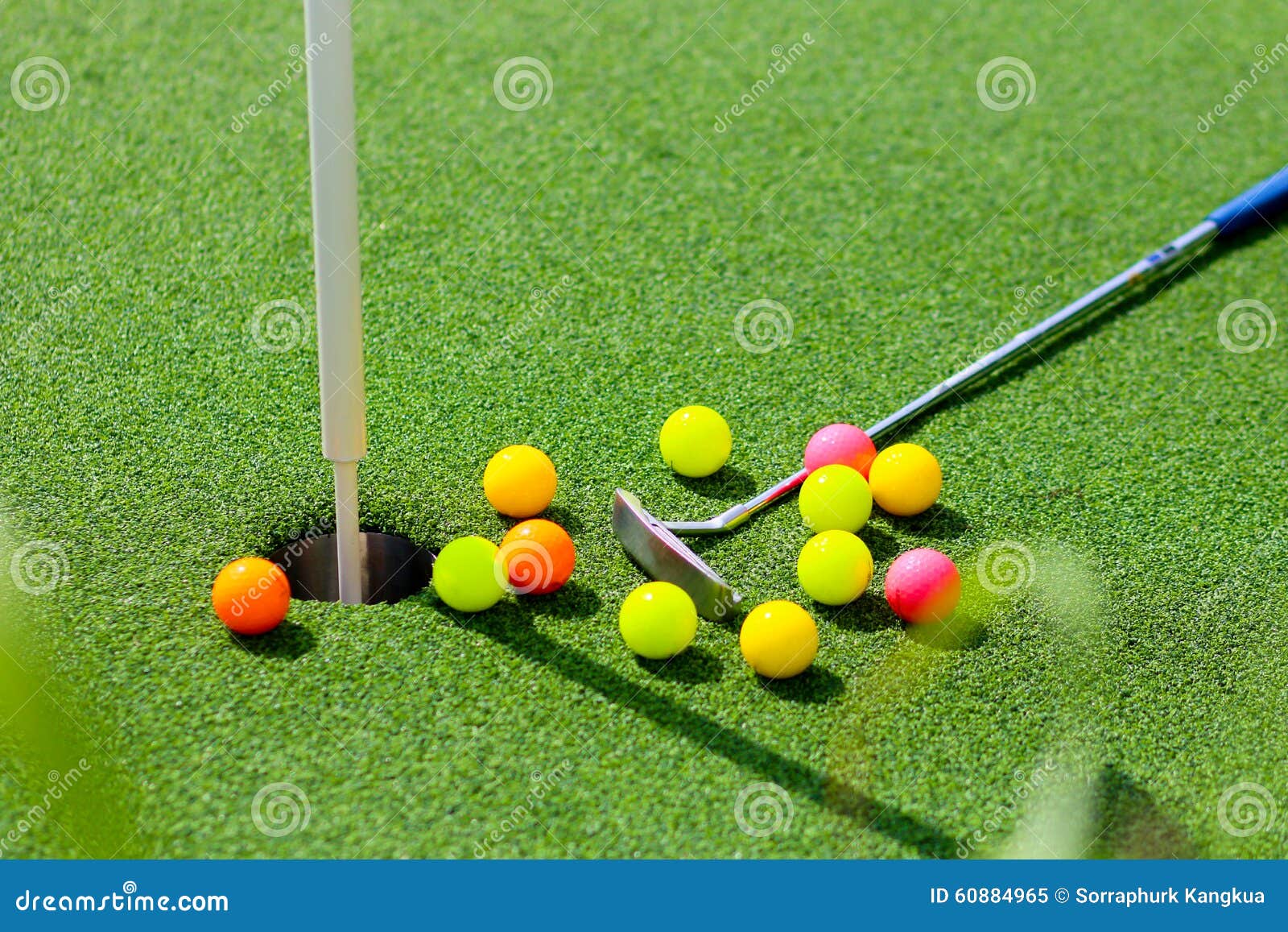 Close-up of Miniature Golf Hole with Bat and Ball Stock Image - Image ...