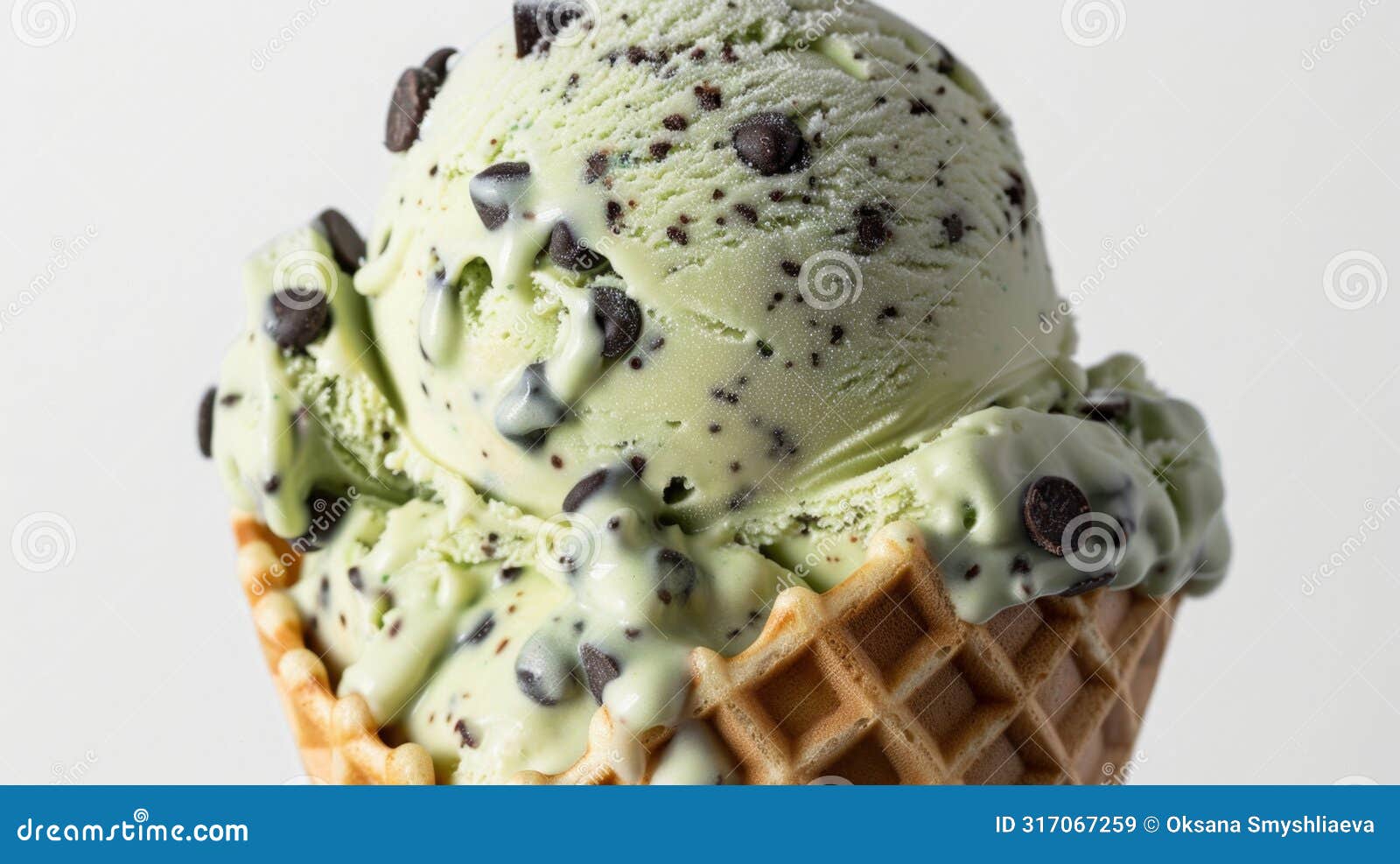 Close-Up of Mint Chocolate Chip Ice Cream Cone on White Background ...