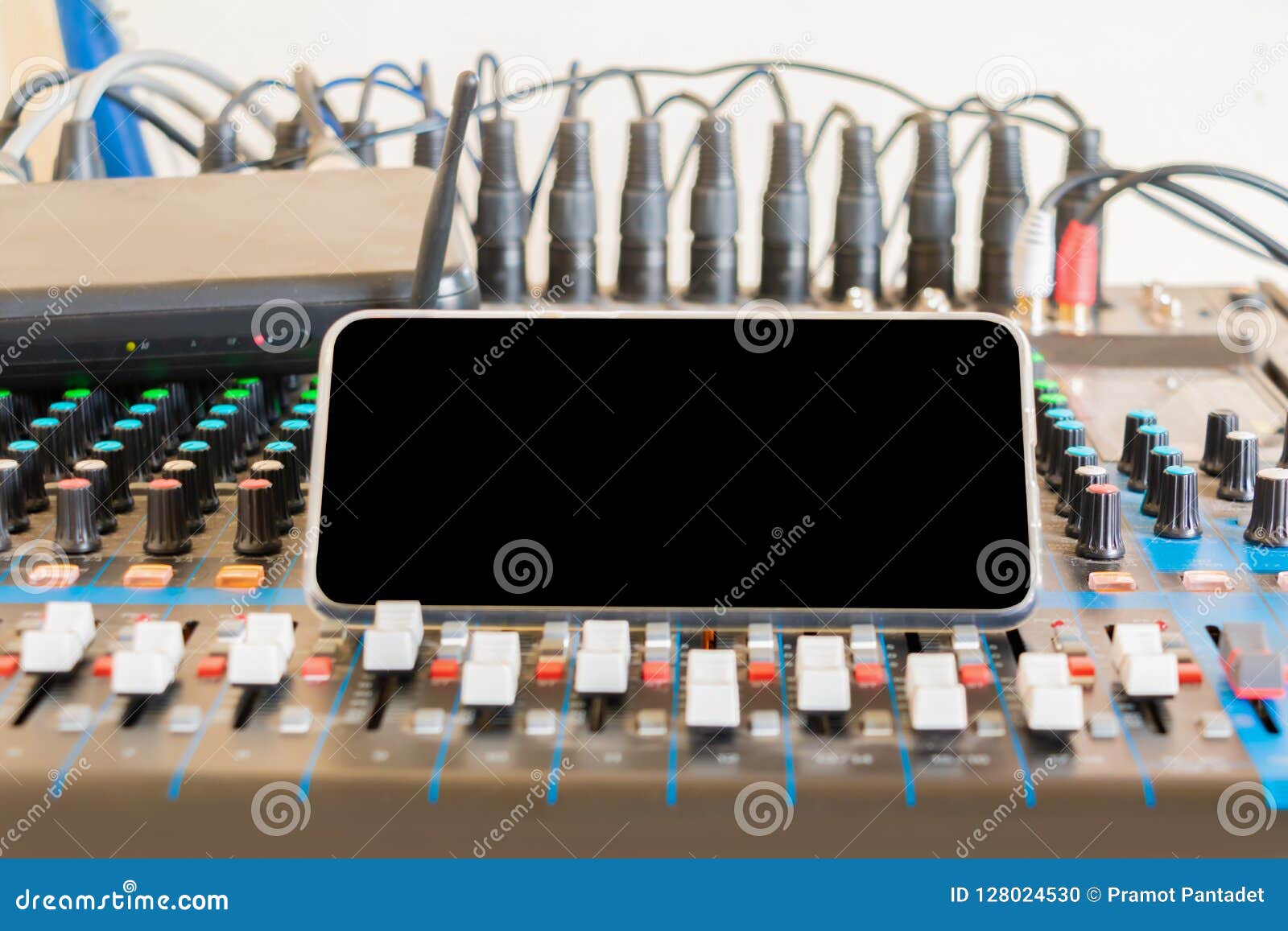 Close Up Mobile Telephone on Audio Mixer Controller in Control Room ...