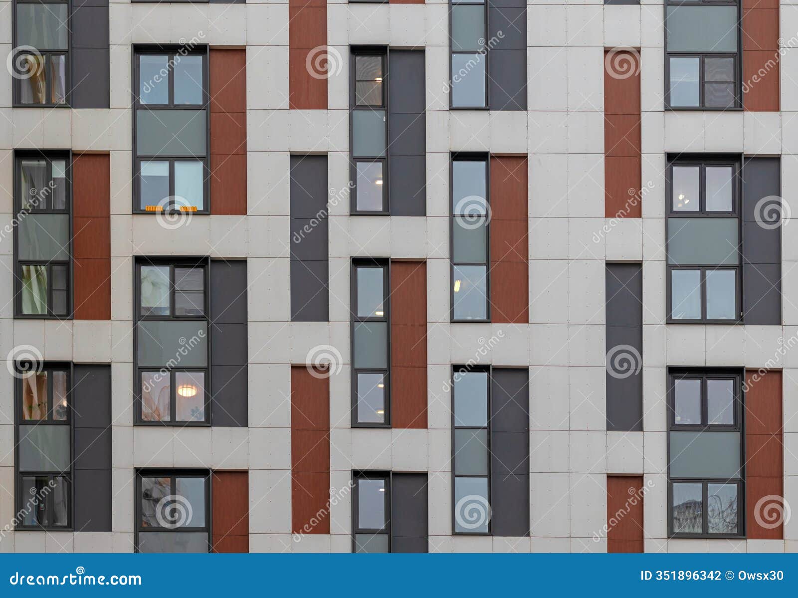 Close-up of a Modern Building Facade with Alternating Windows and Panel ...