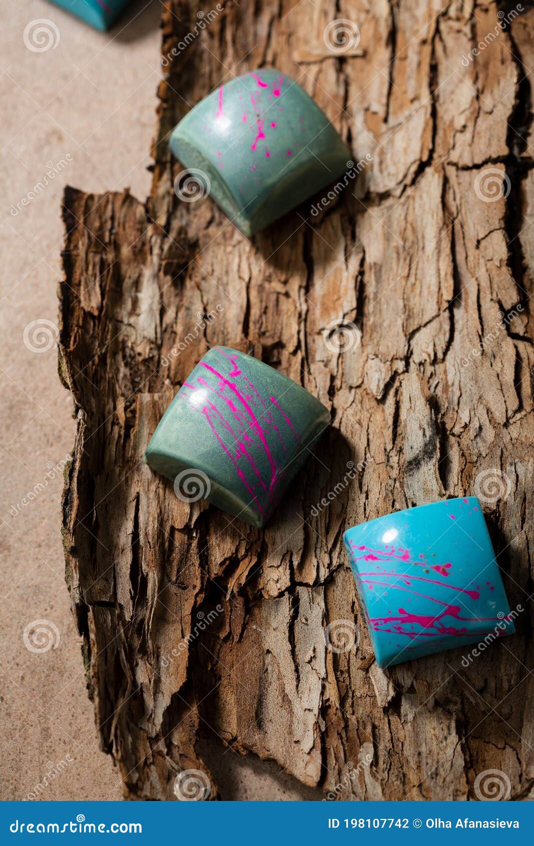 Close Up of Modern Chocolate Candies on Wood Stock Photo - Image of ...