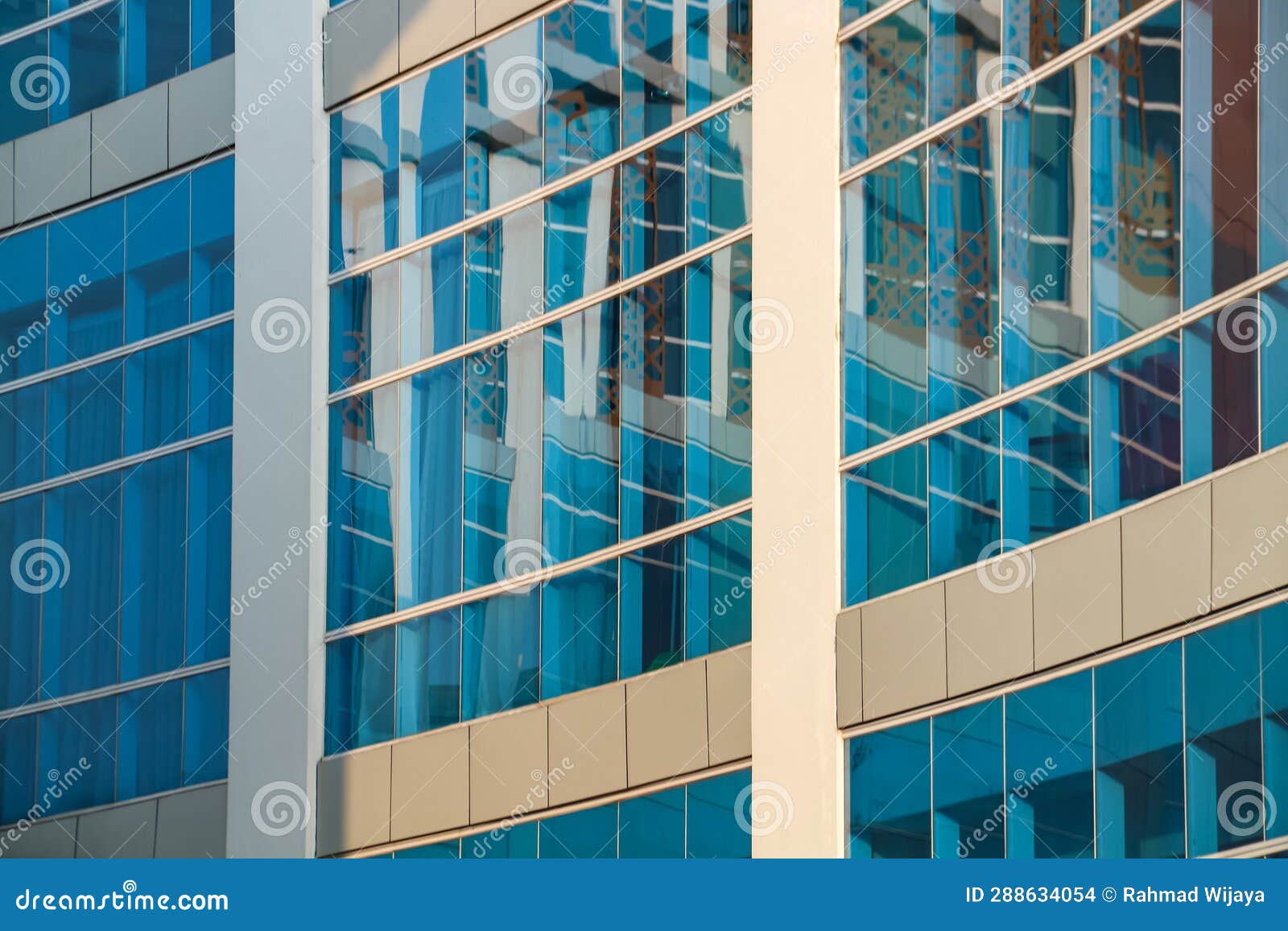 Close Up of Modern Office Building with Blue Glass Facade and Sunlight ...