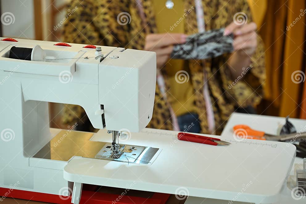 Close Up of a Modern Sewing Machine in a Designer Workspace Stock Photo ...