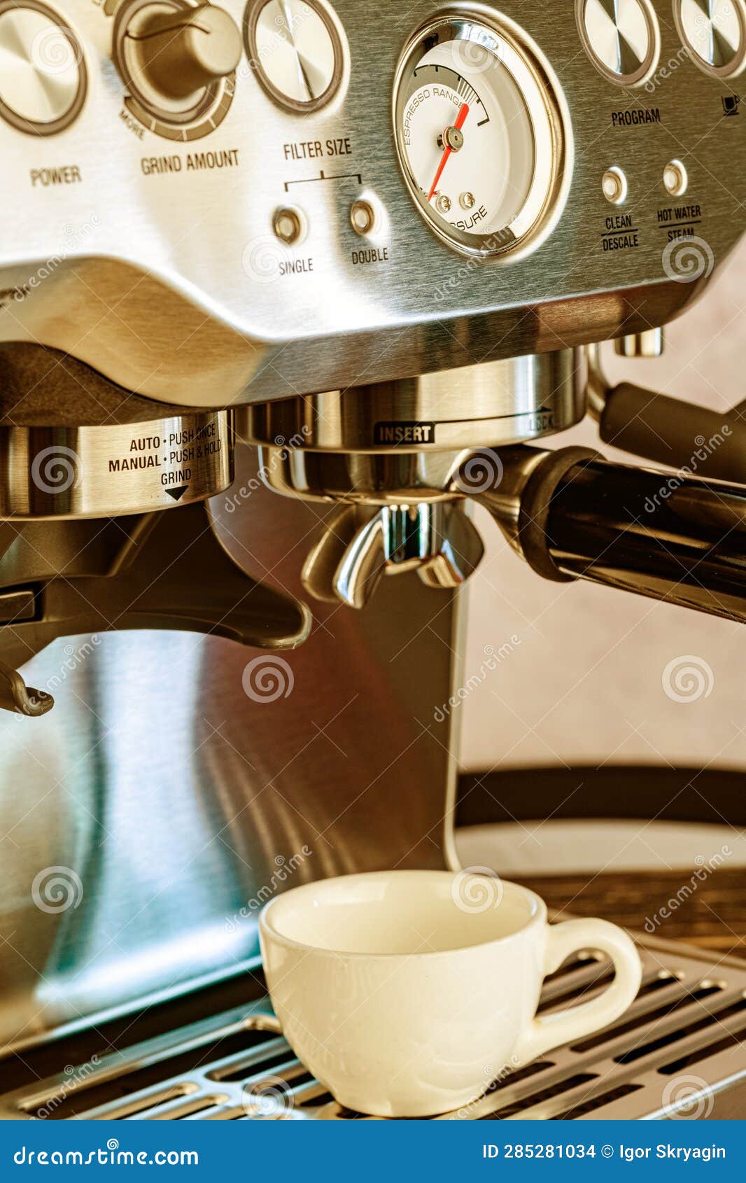 Close-up of a Modern Steel Coffee Machine with Control Buttons and a ...