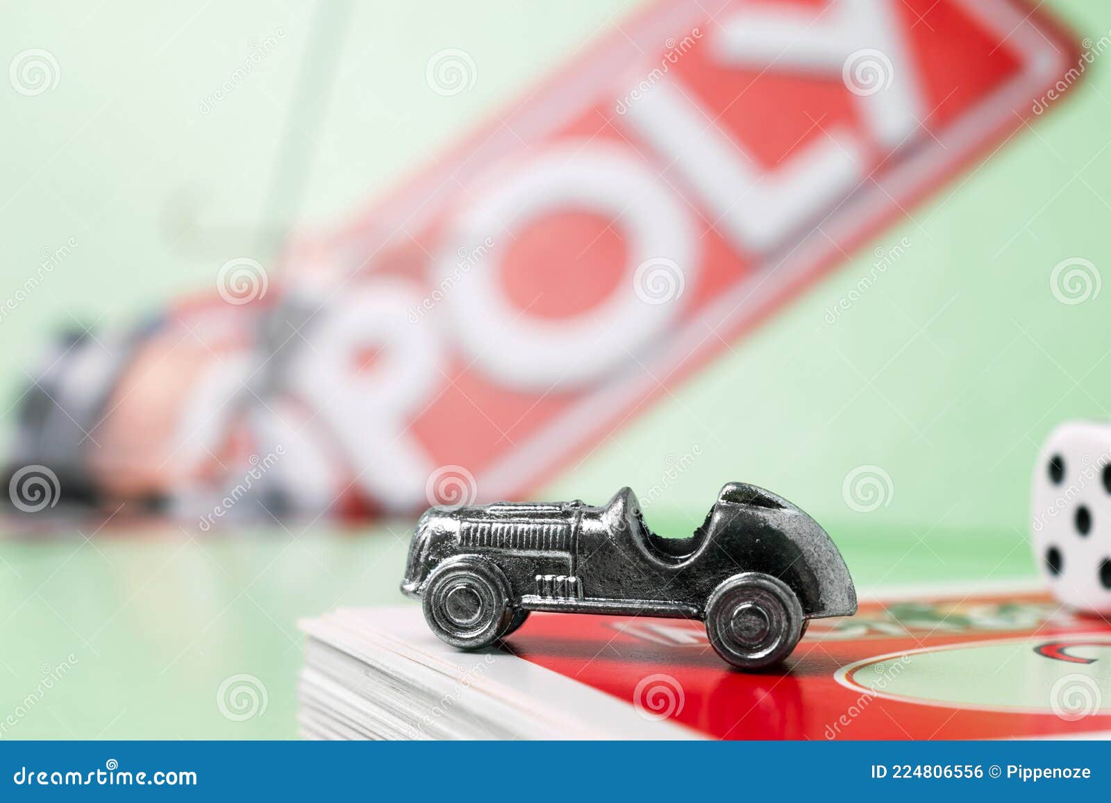 Close Up of Monopoly Car, Monopoly Board and Dices on the Monopoly ...