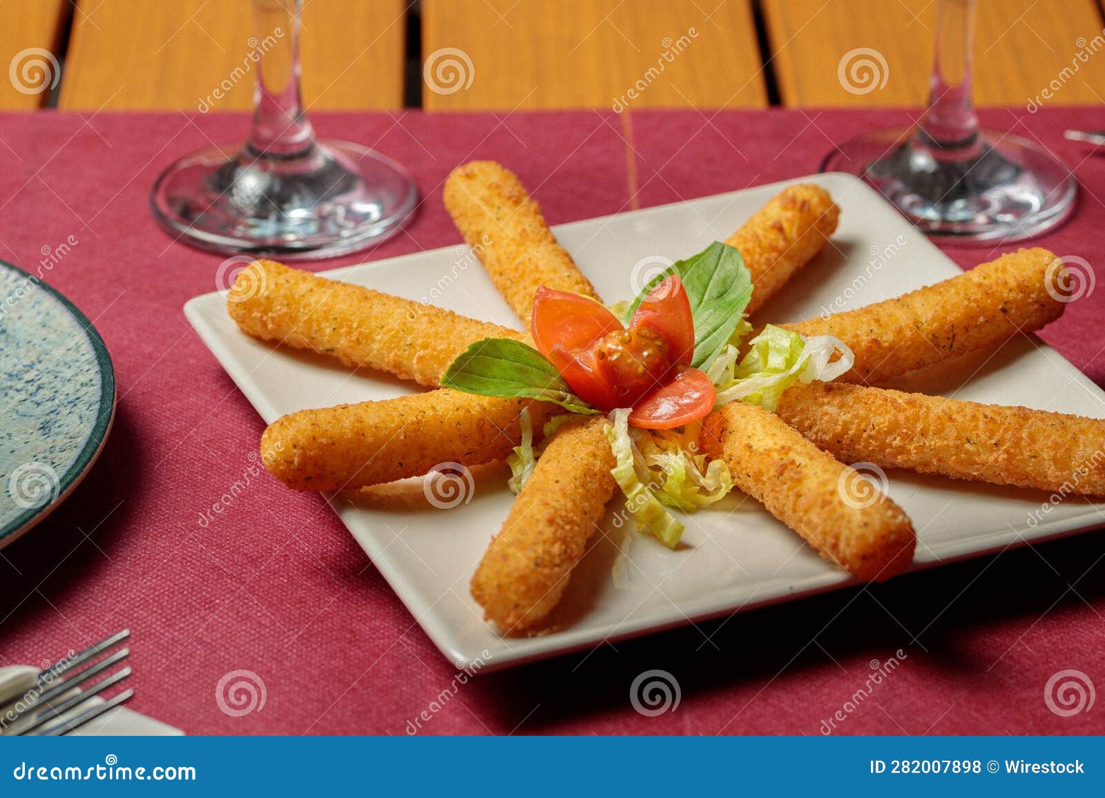 Close Up of Mozzarella Sticks on a Square Plate Stock Photo - Image of ...