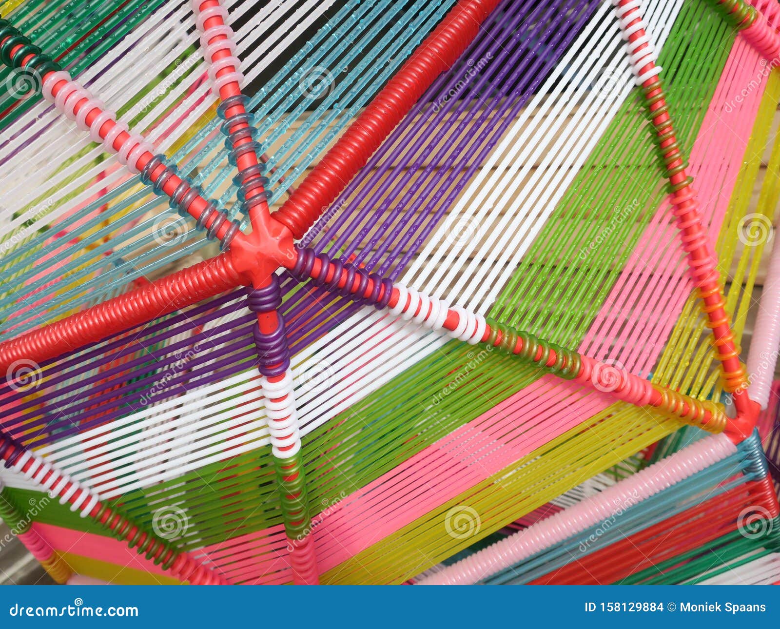 Close-up of a Multi Colored Chair Made of Plastic Wire 3 Stock Photo ...
