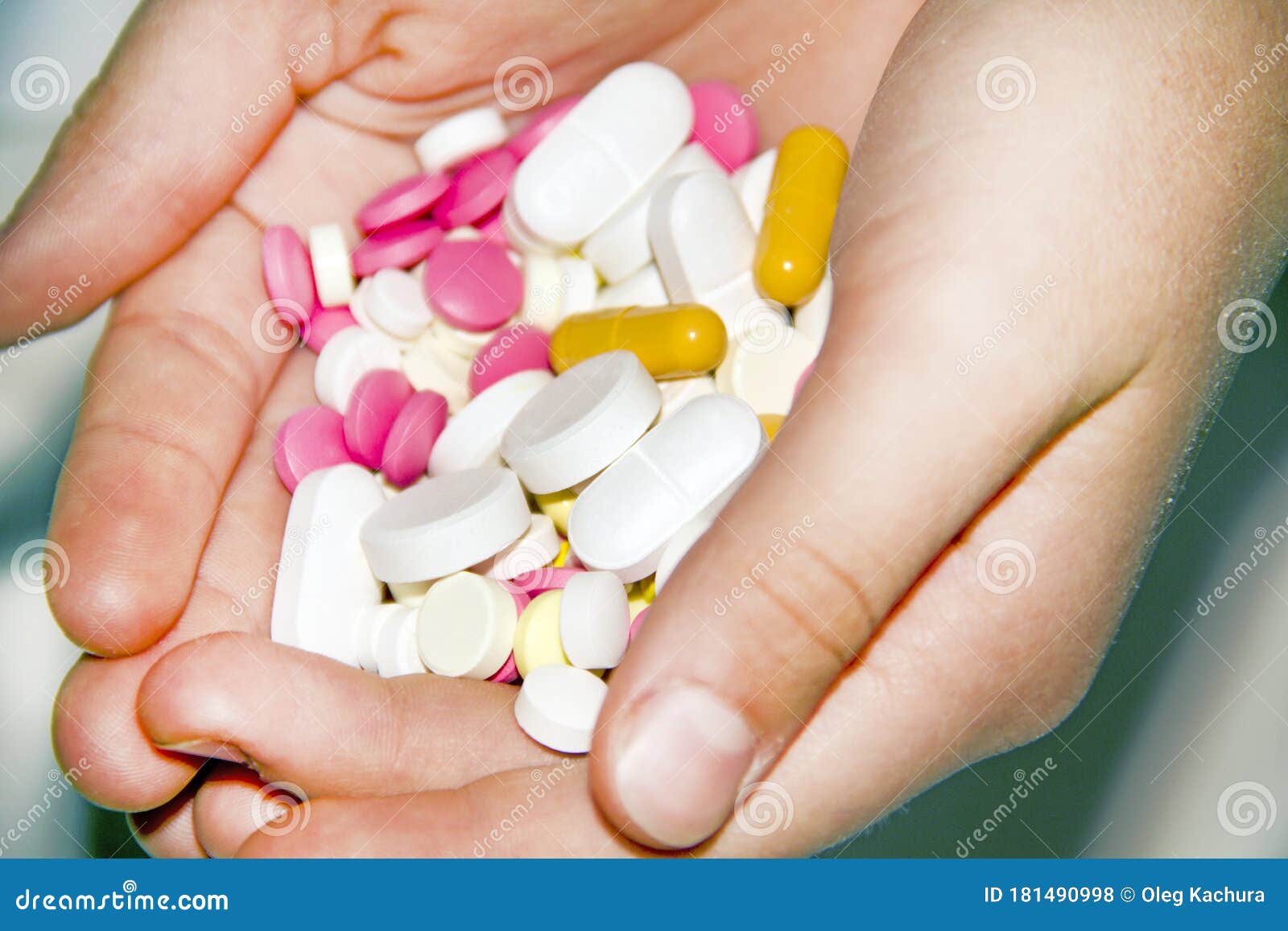 Close-up of Multi-colored Pills and Capsules on the Open Palm of a ...