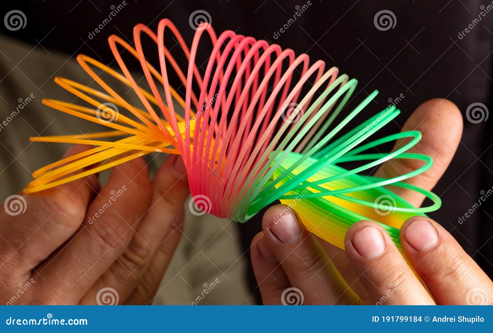 Close-up of a Multi-colored Slinky Spring in a Hand Editorial Stock ...