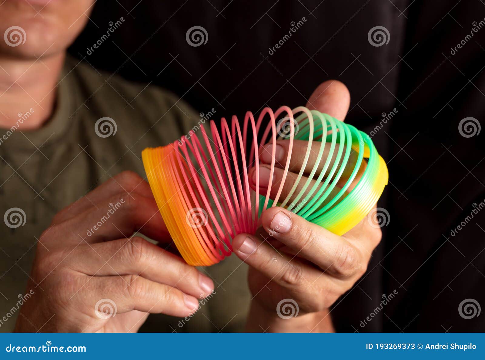 Close-up of a Multi-colored Slinky Spring in a Hand Editorial Stock ...